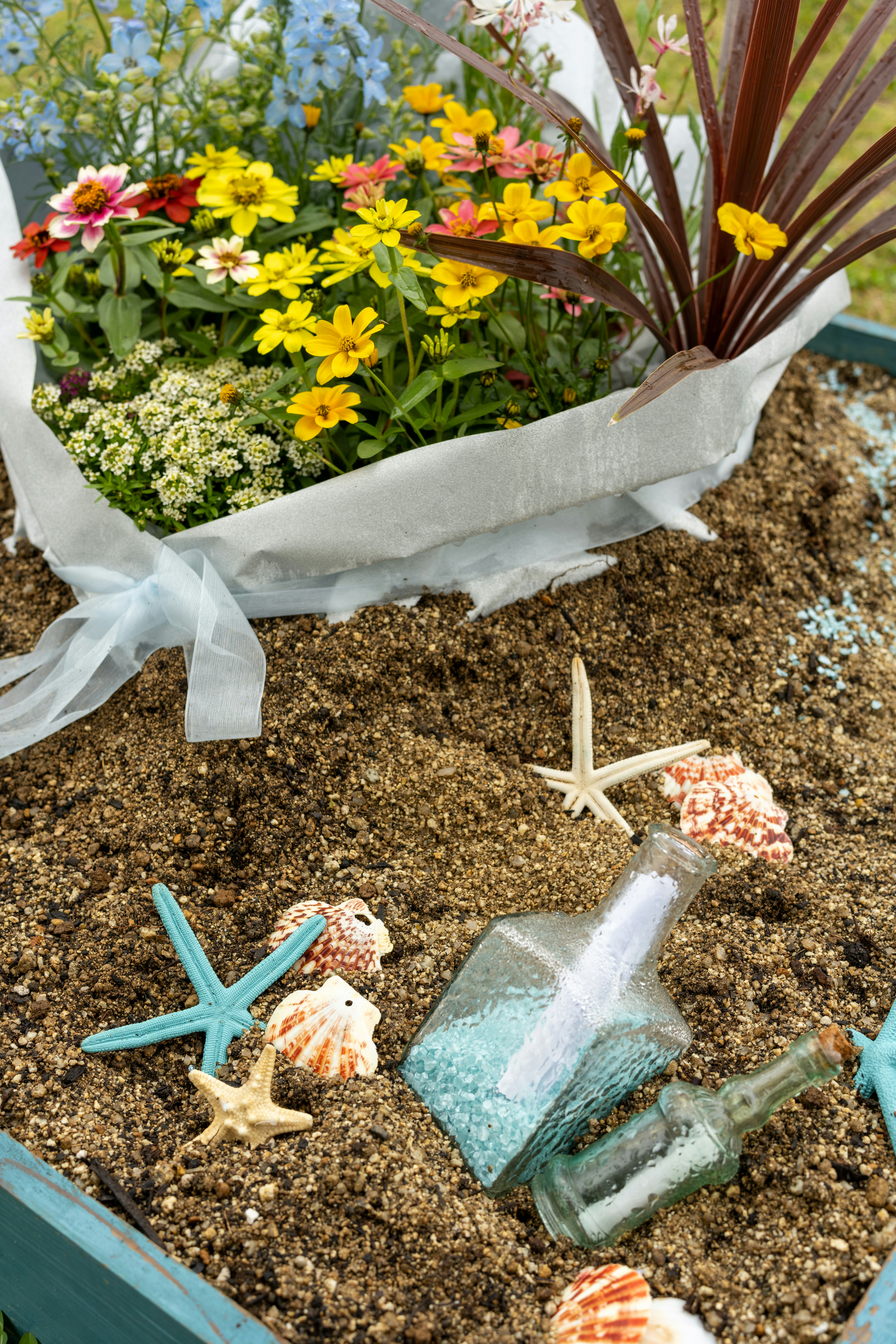 Sunlit Border Treasures: A Floral Miniature in a Sanded Garden Scene
