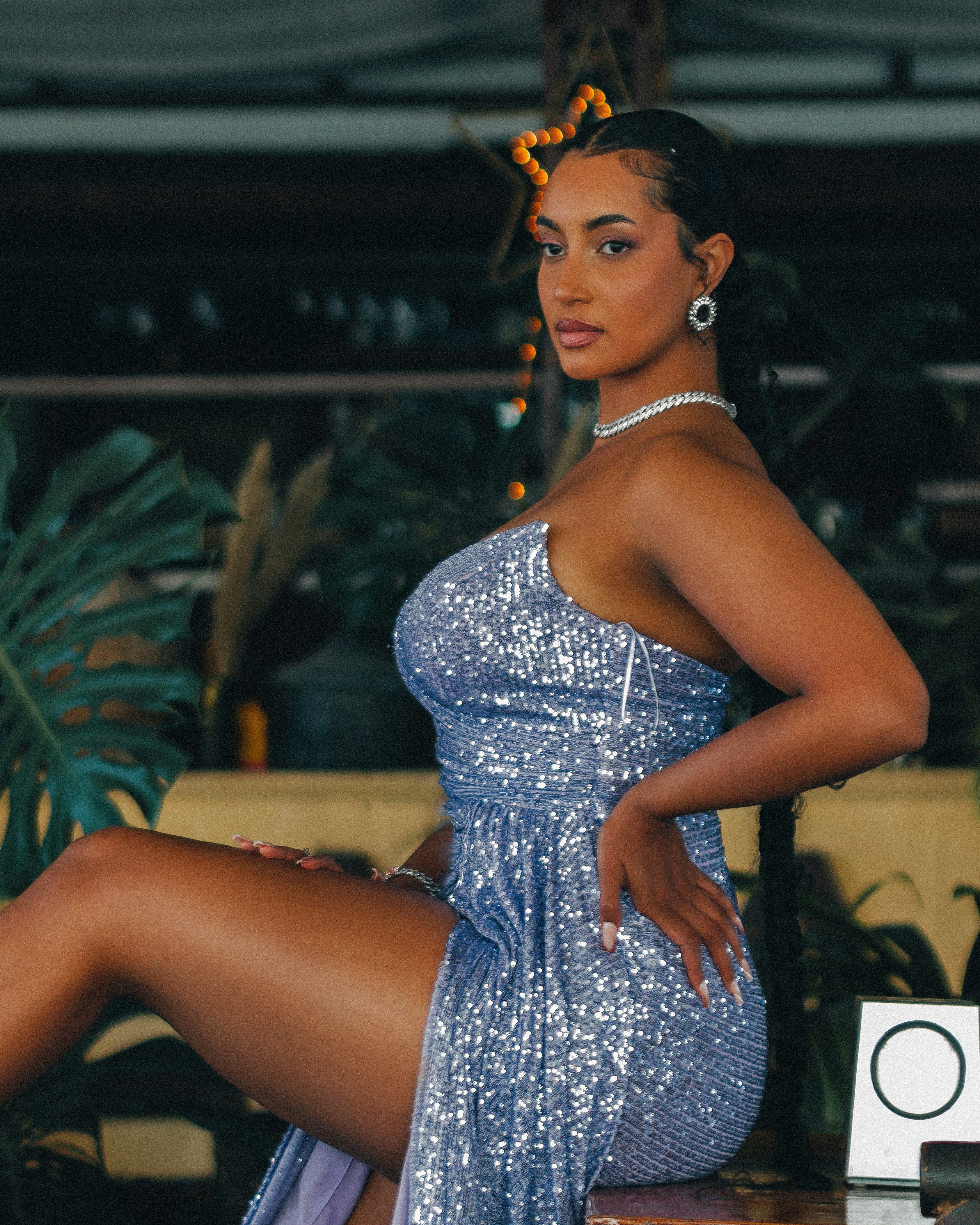 Glittered Duo: A graceful pose in blue sequins at dusk backdrop