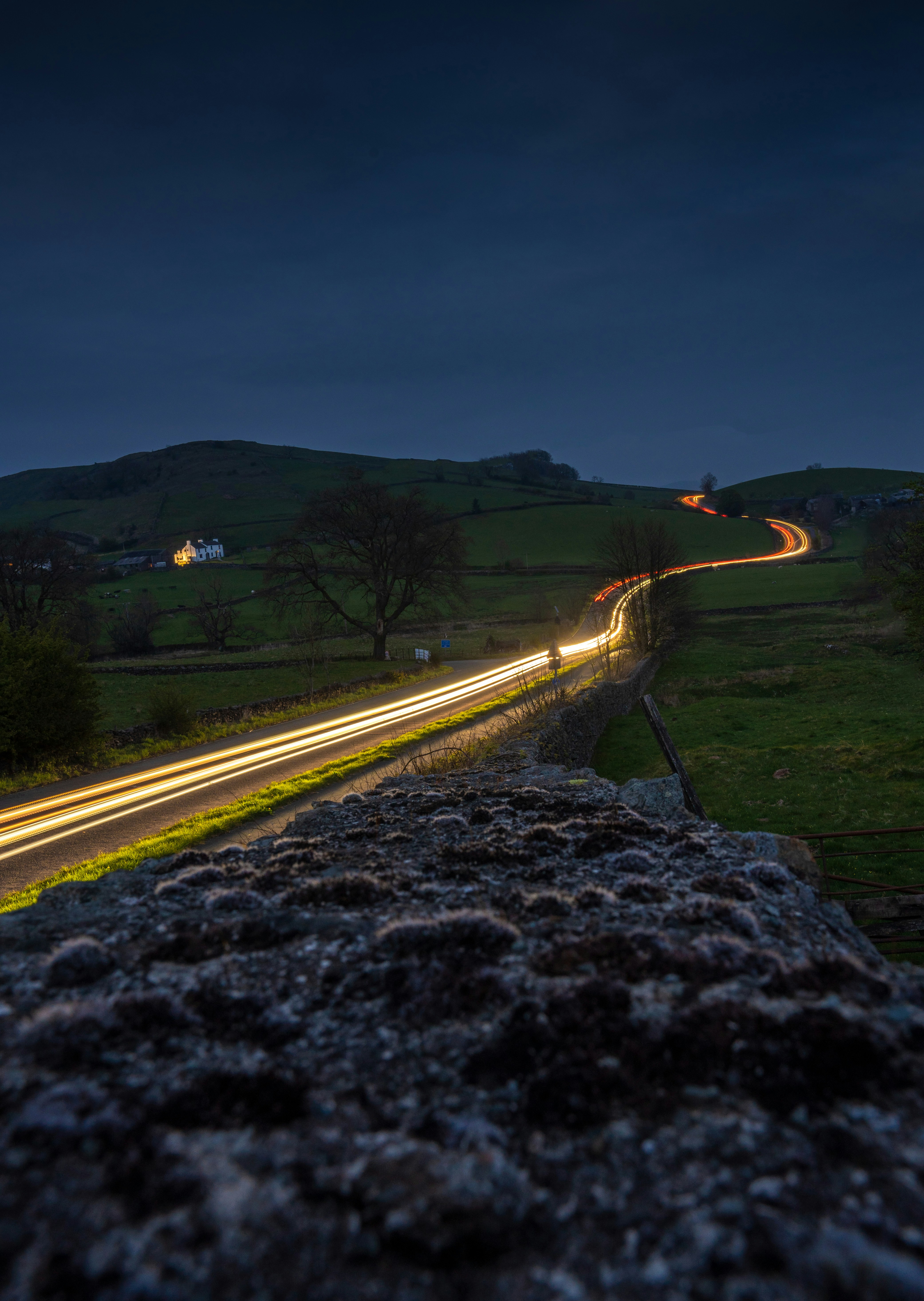 Winding Highway of Light Through Quiet Dales at Dusk