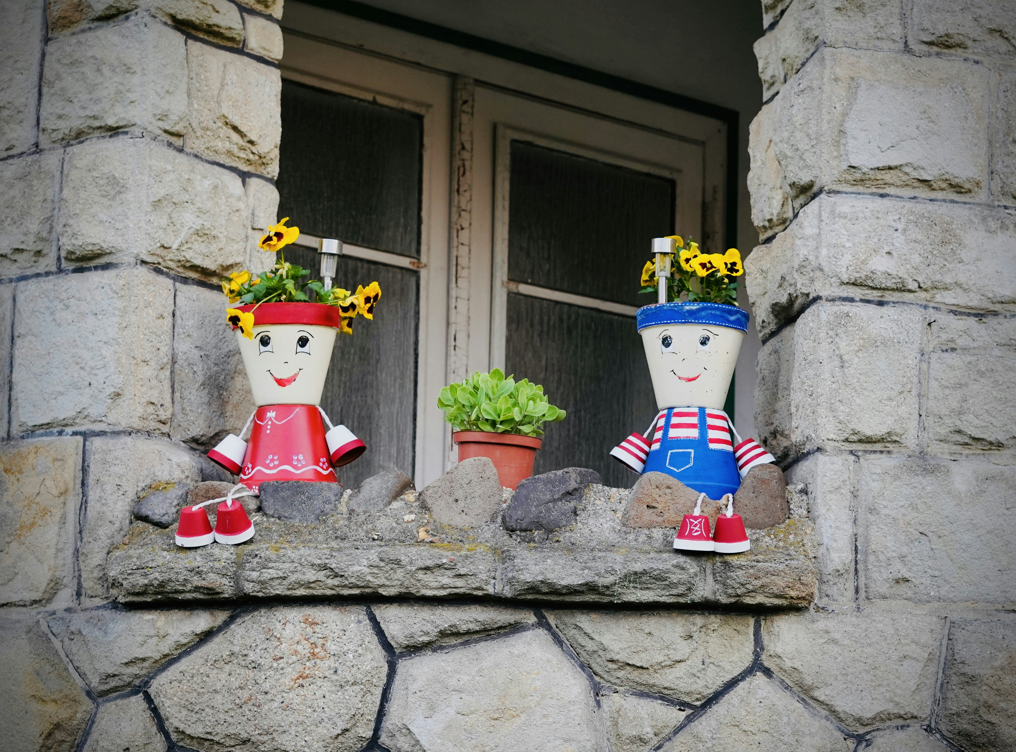 Sunflower Crowns on a Stone Window: A Whimsical Potscape