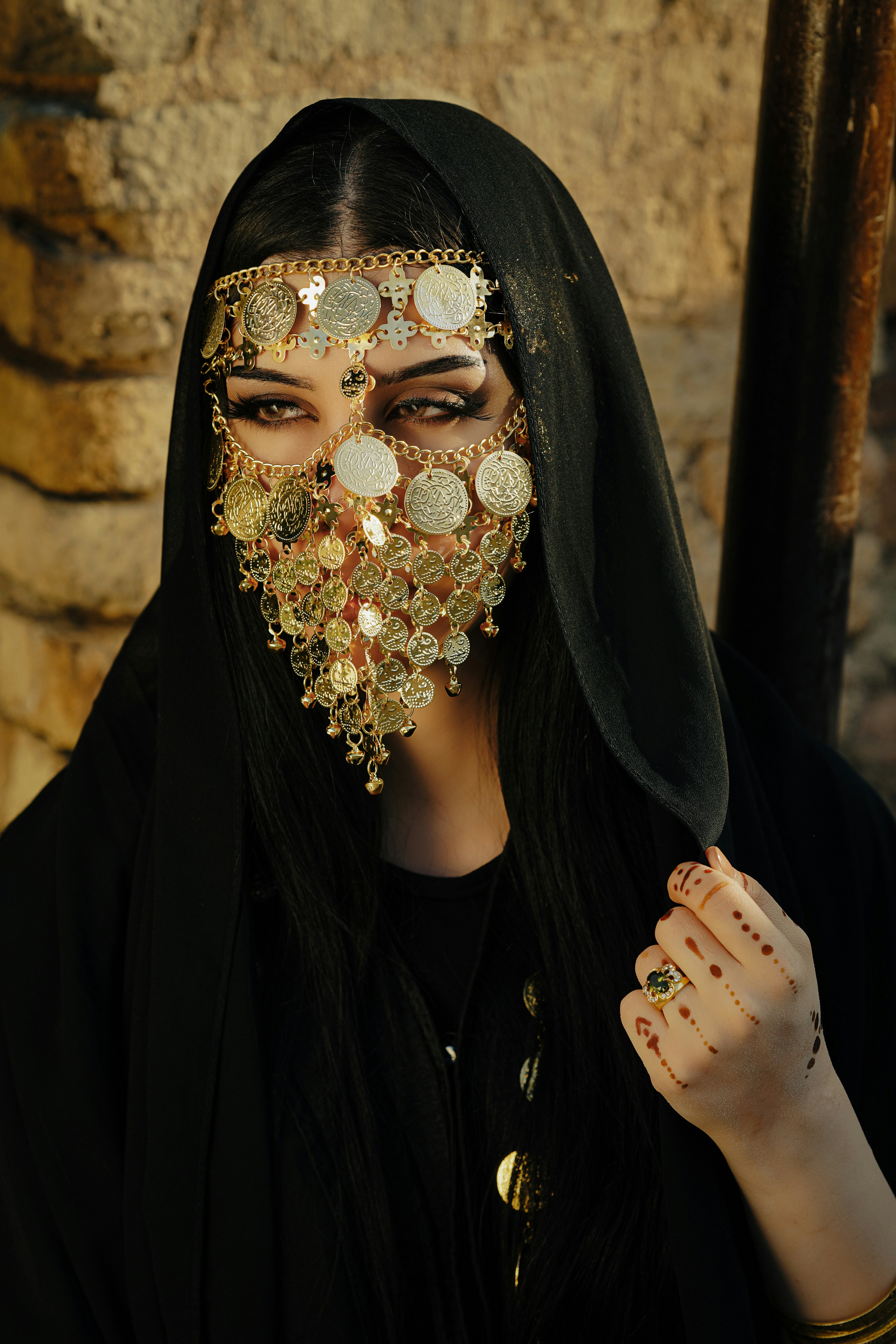 A woman wearing a black veil and a gold mask photo – Free Person Image ...