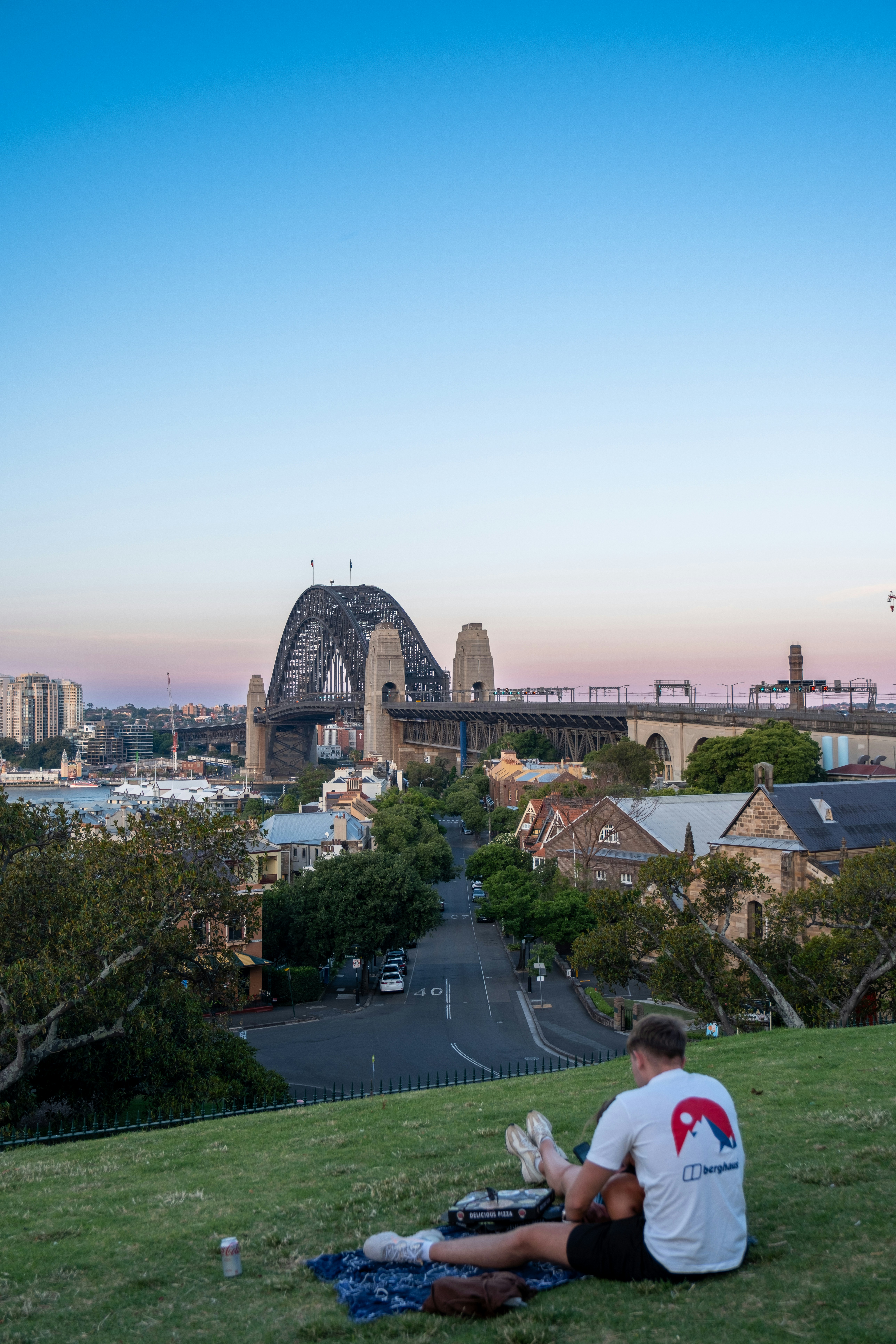 A Picnic Above the Steel Arc: Sunset Over the Harbour City