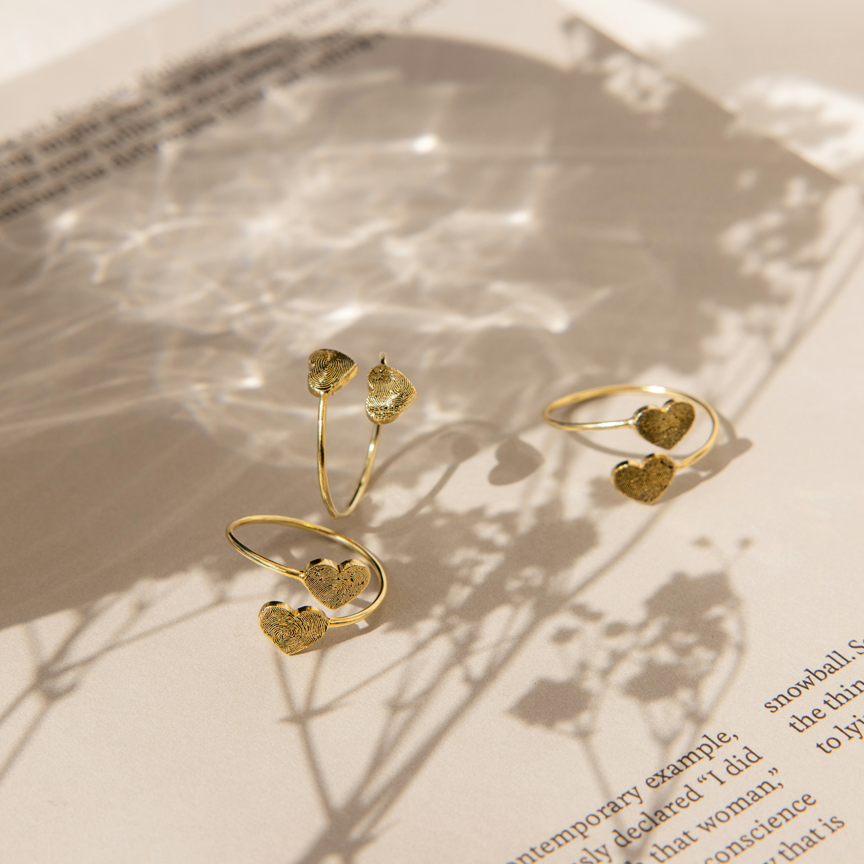 Two gold rings sitting on top of an open book photo – Free Usa Image on ...