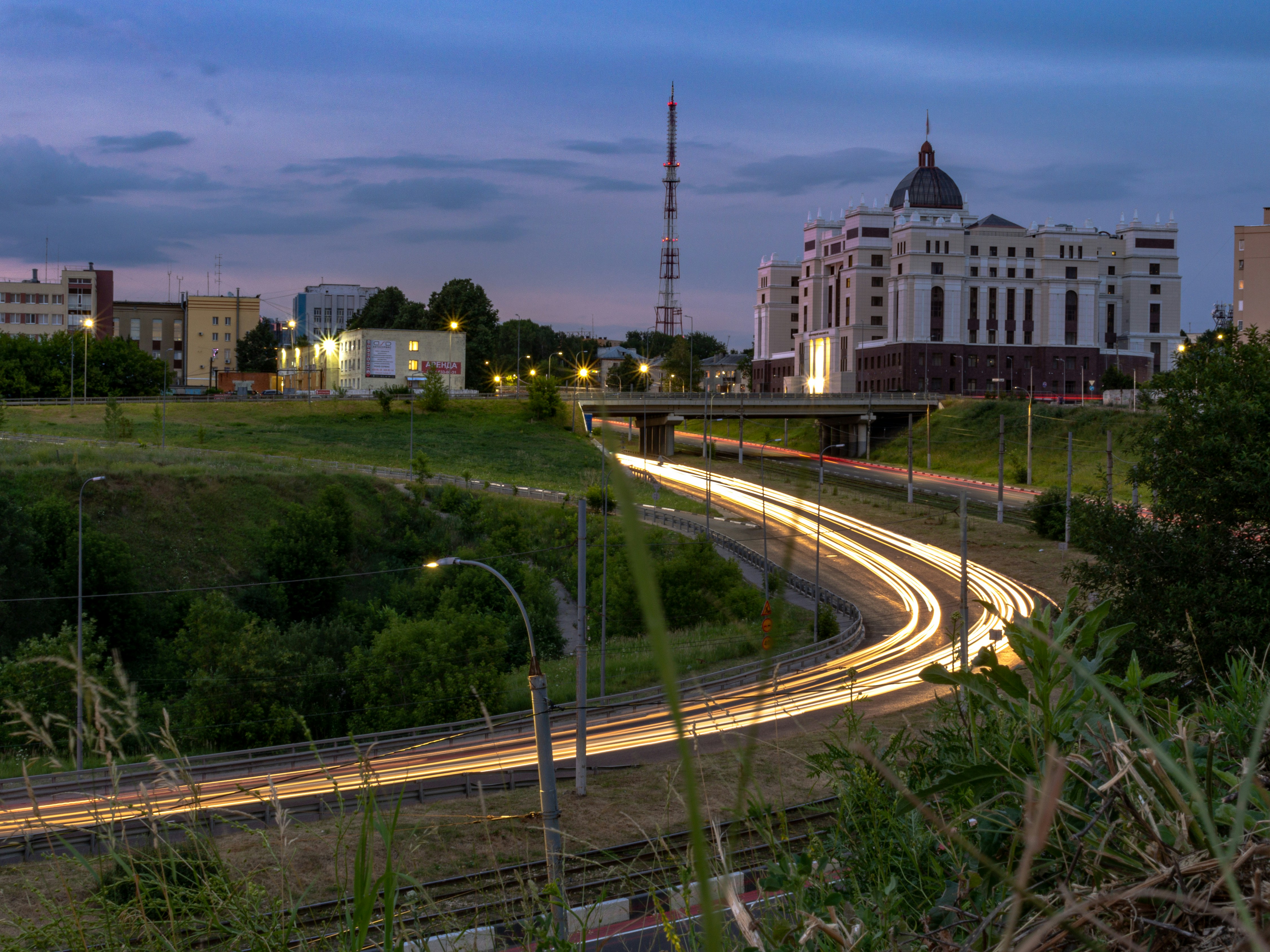Twilight Curves: A Winding Ribbon of Light Through a Quiet Cityscape