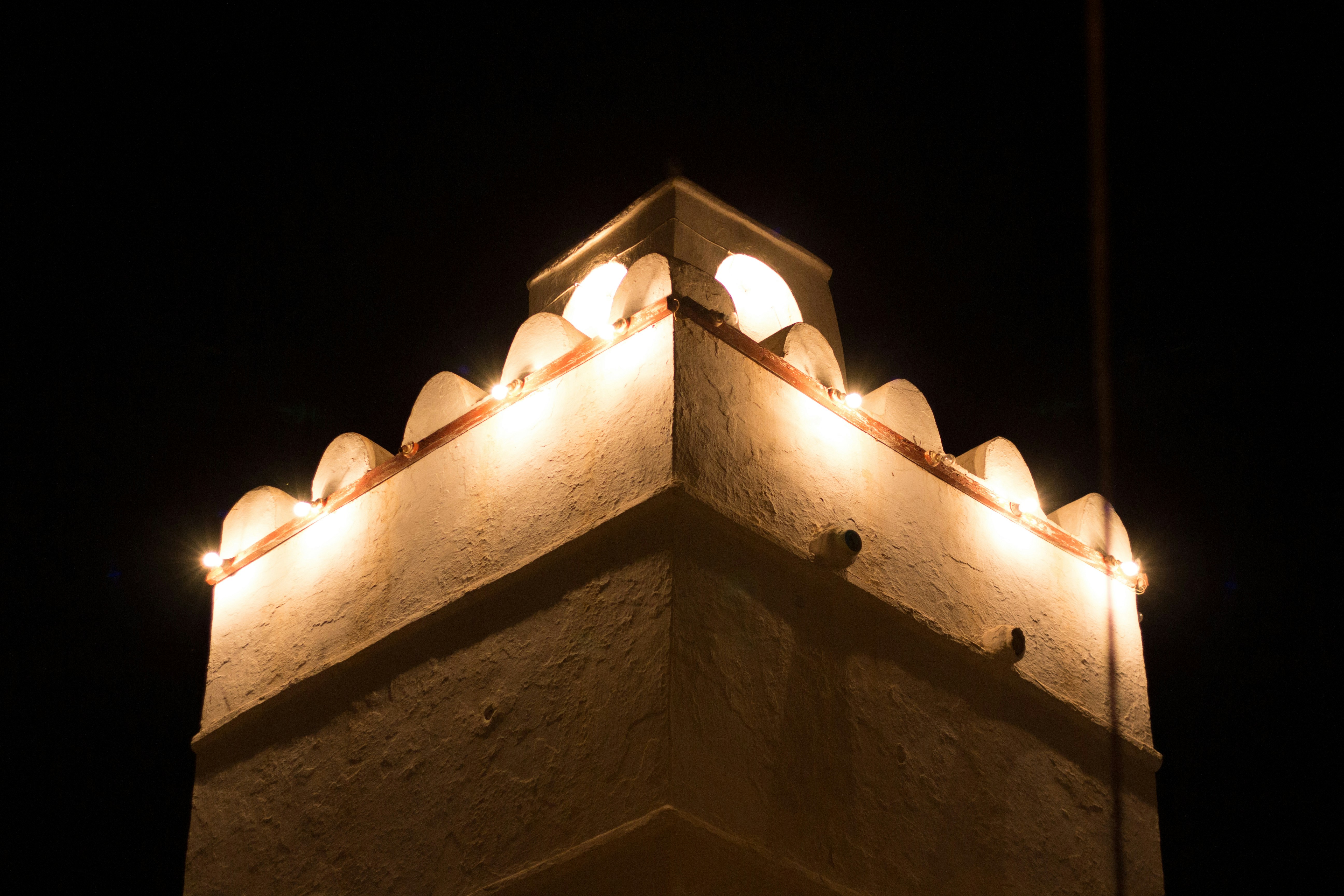 A tall tower with lights on top of it photo – Free Kairouan Image on ...