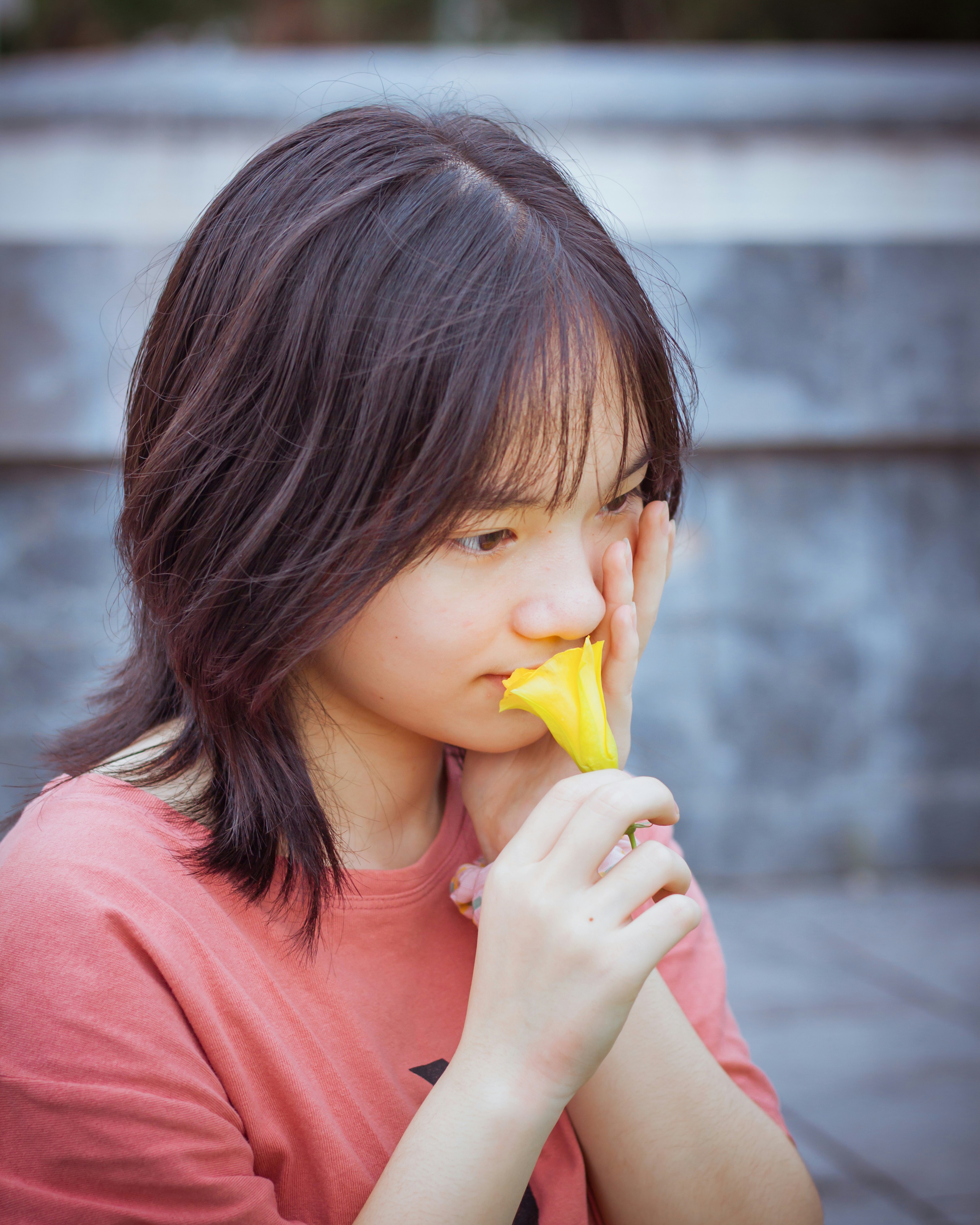 Tender Fragrance: A Quiet Portrait with a Yellow Bloom