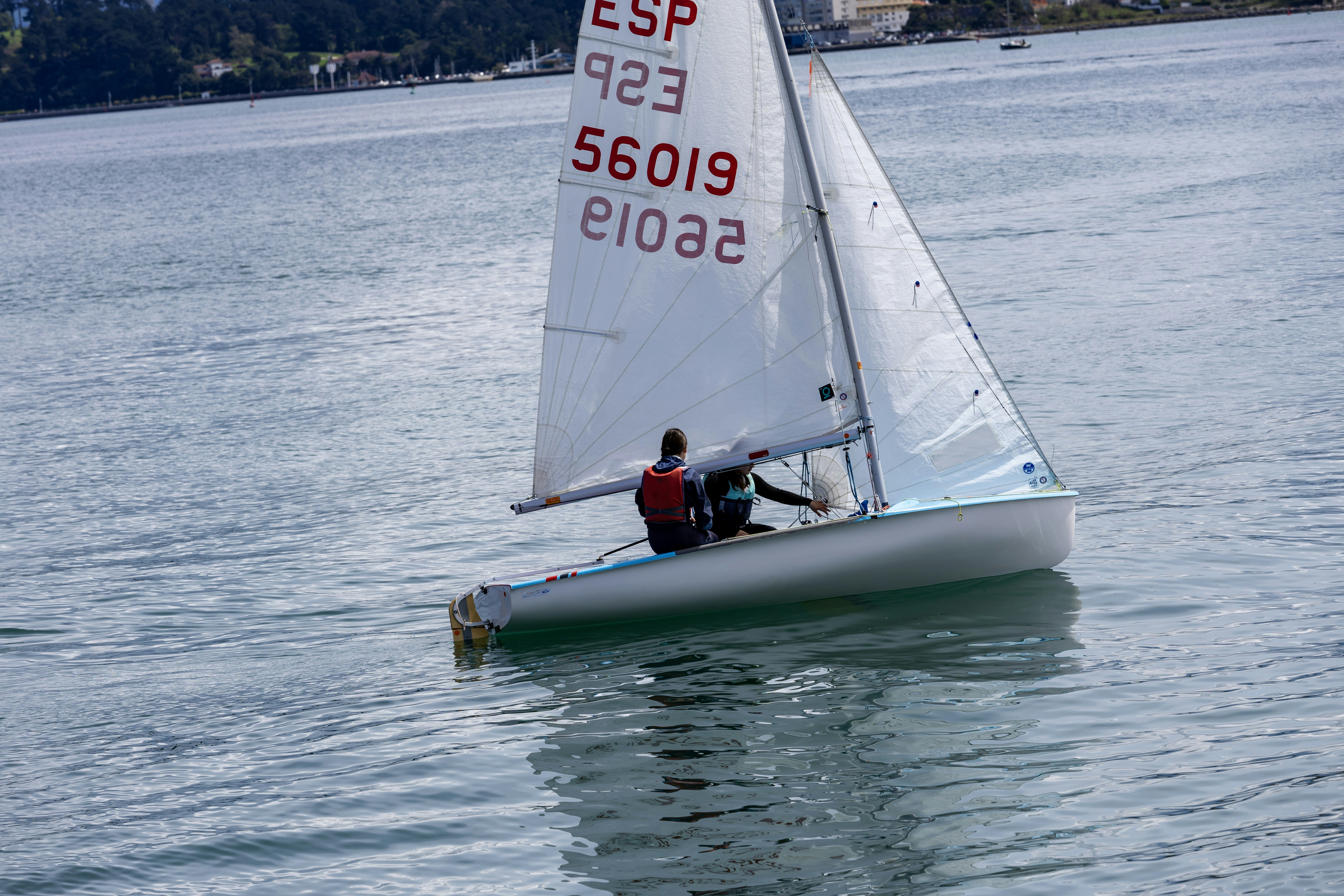 Dinghy in Quiet Glide: ESP Sails Over a Glassy Lake