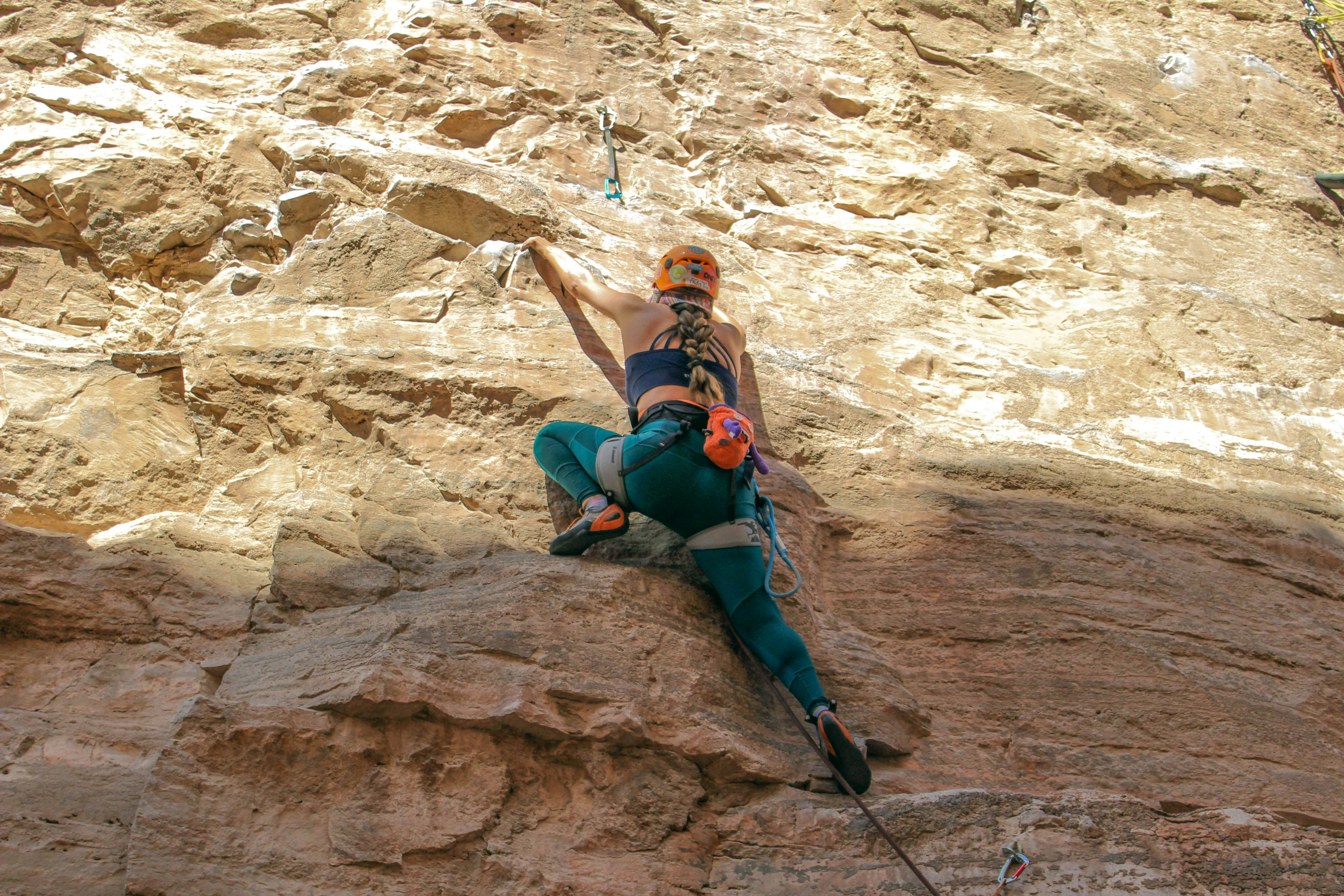 A woman climbing up a mountain with a rope photo – Free Chile Image on ...