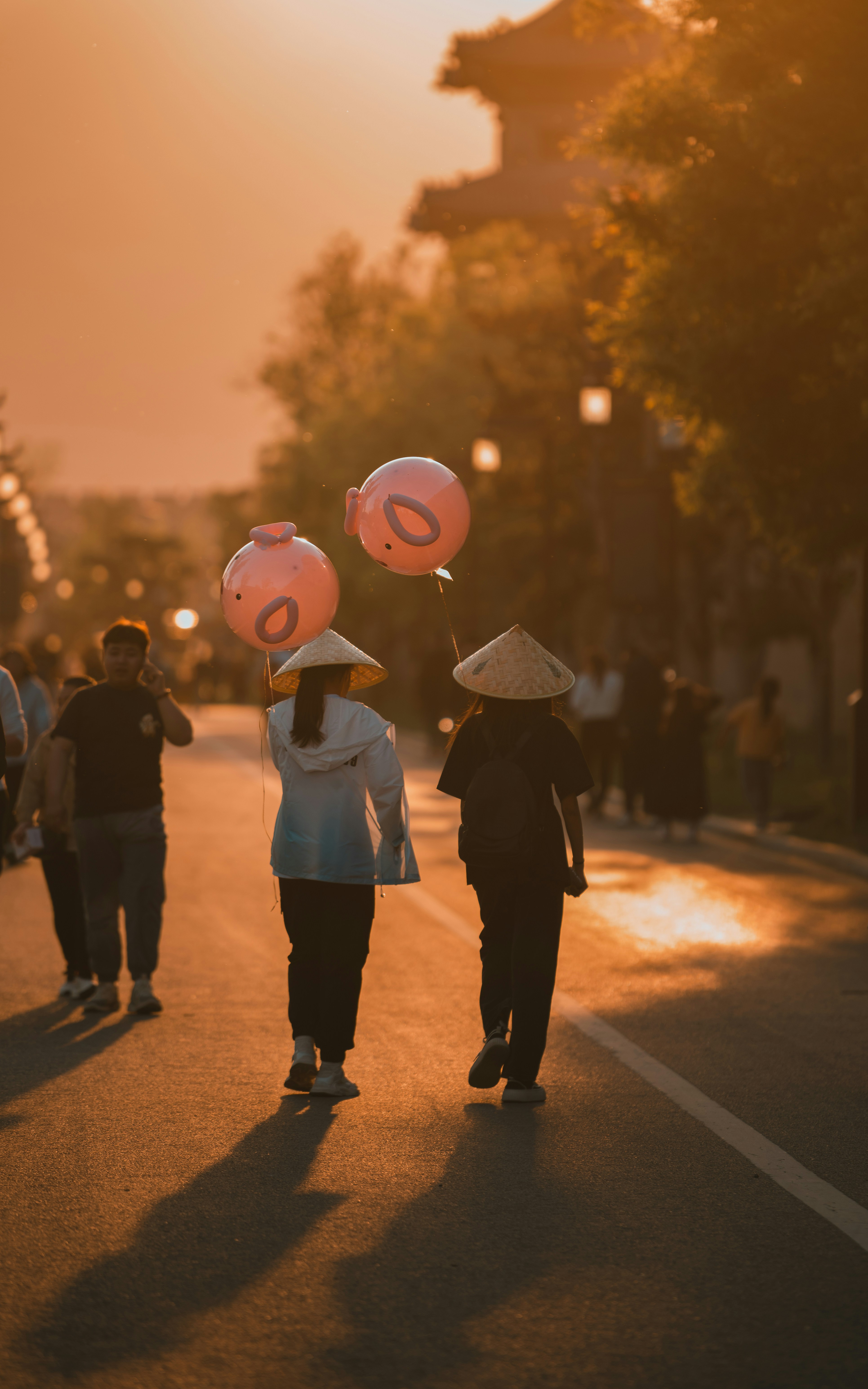 a group of people walking down a street