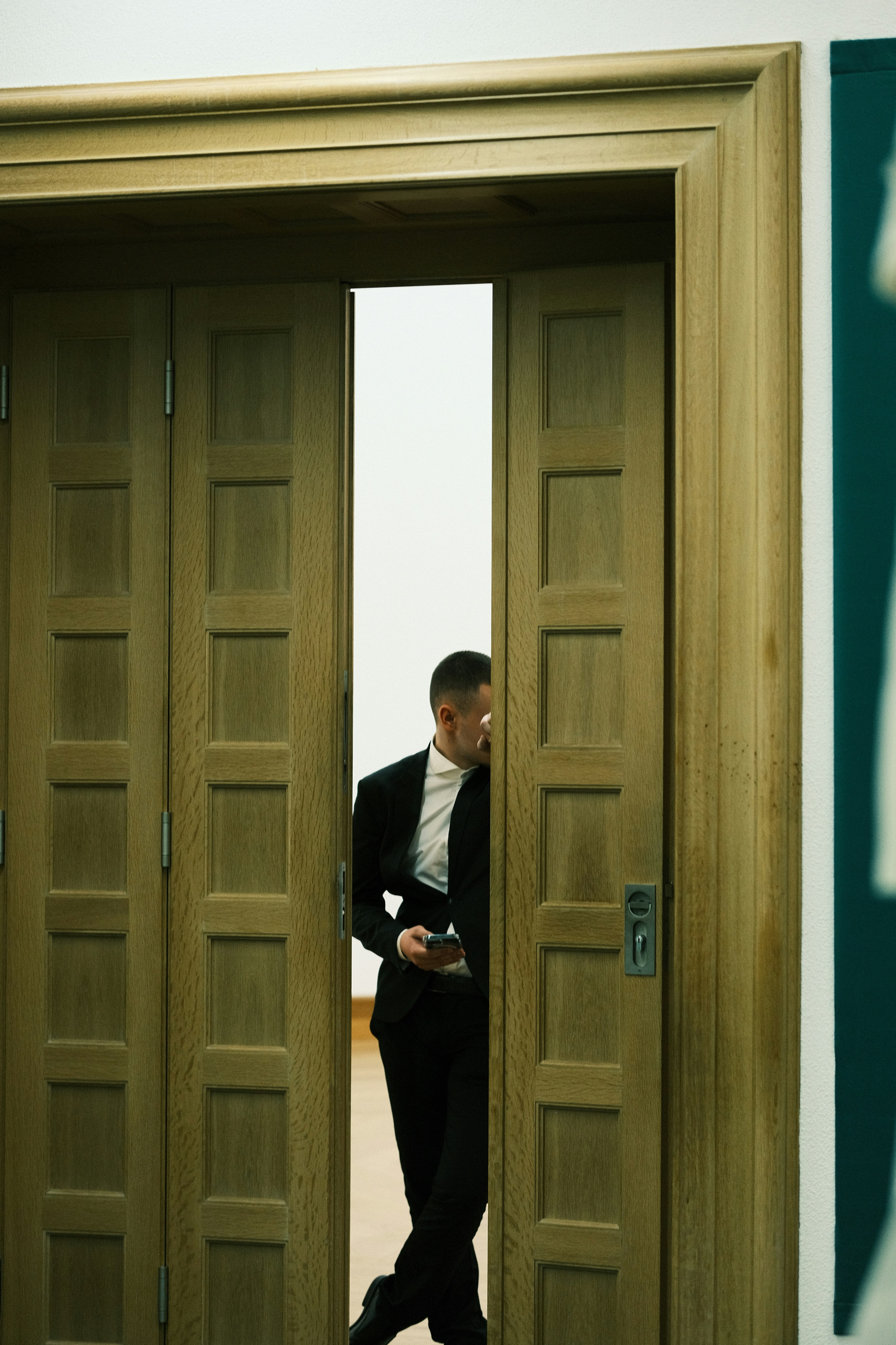 A man in a suit standing in a doorway photo – Free Friedrich-ebert ...