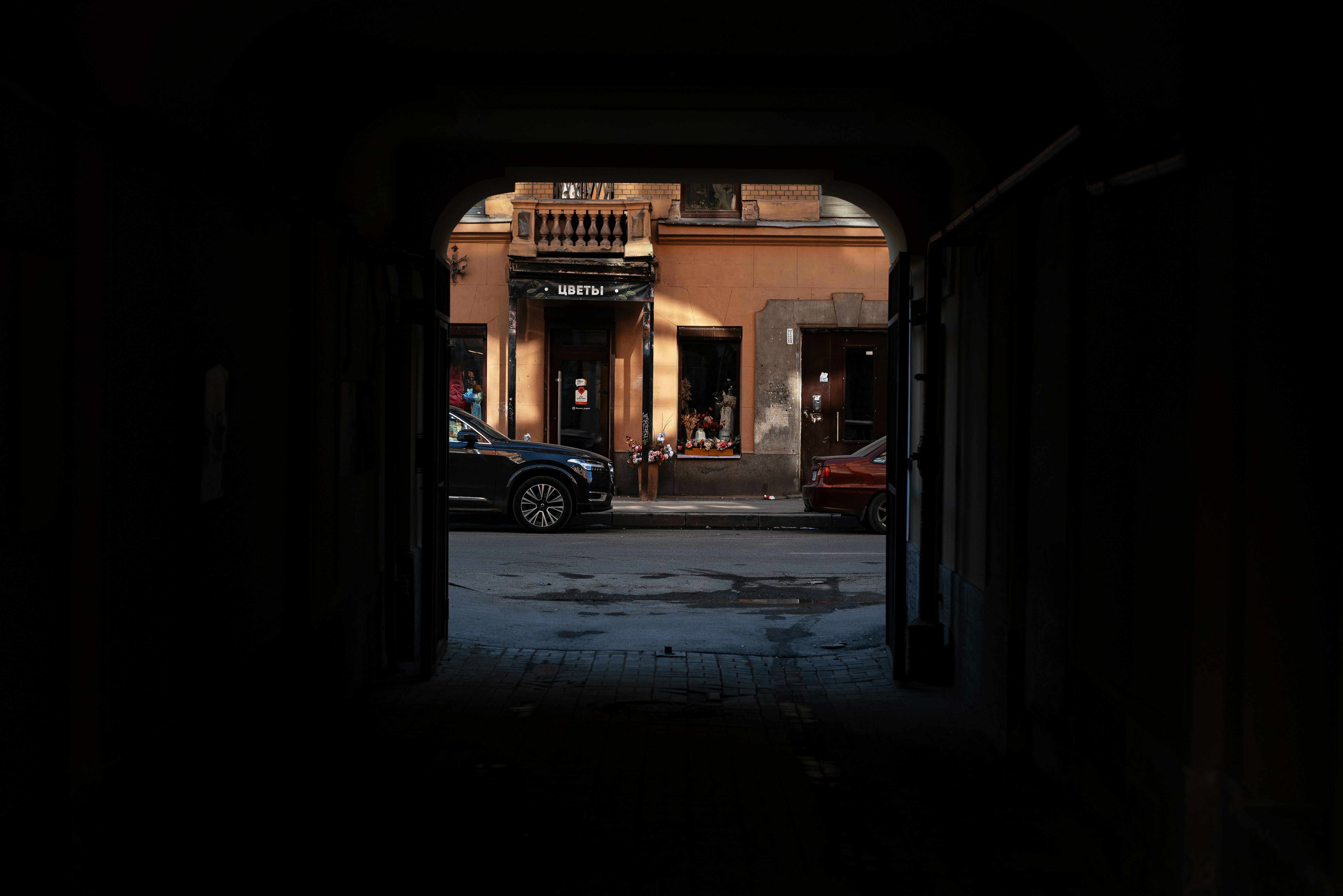 A car is parked in a dark alley way photo – Free Saint petersburg Image ...
