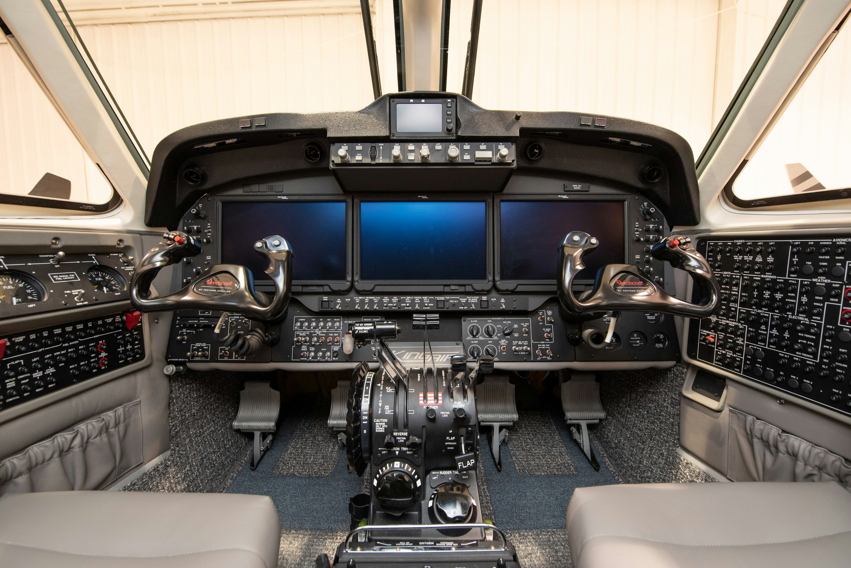 The cockpit of an airplane with multiple monitors photo – Free Aircraft ...