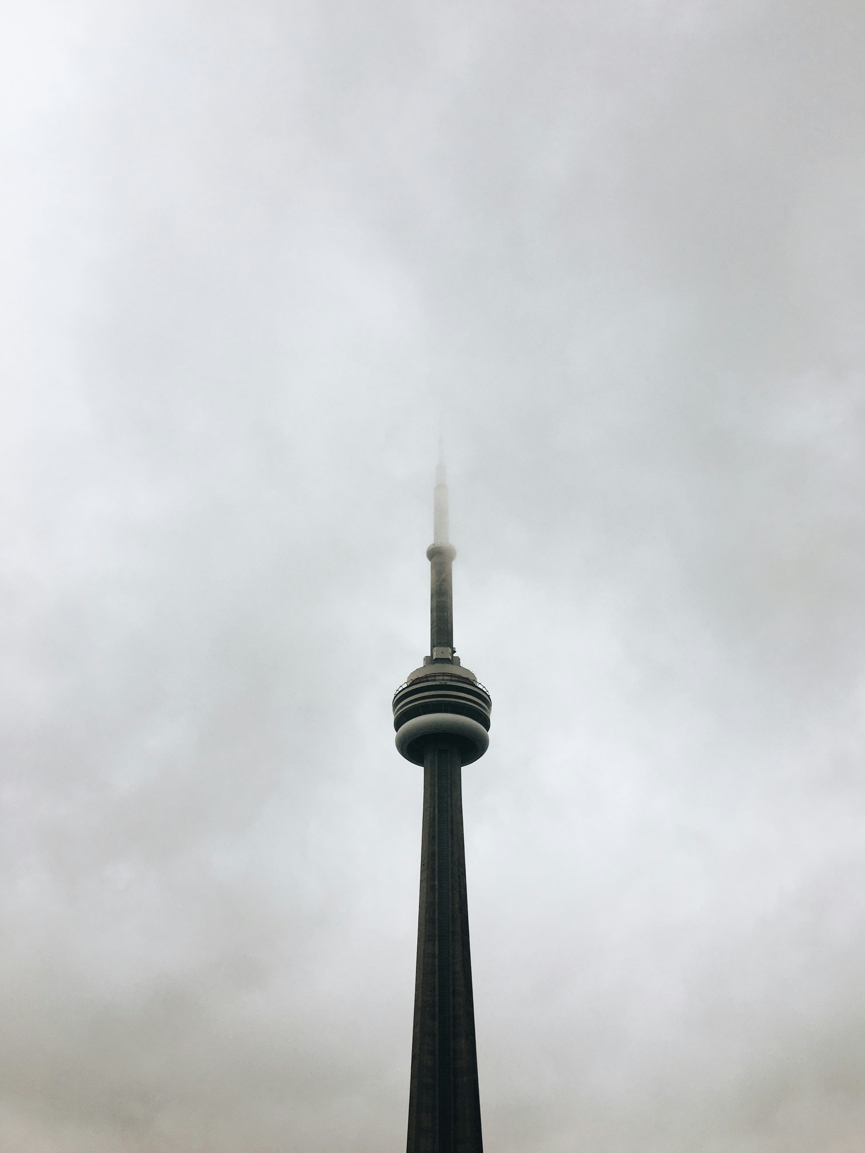 Misty Spire: CN Tower Piercing a Quiet, Cloudy Sky
