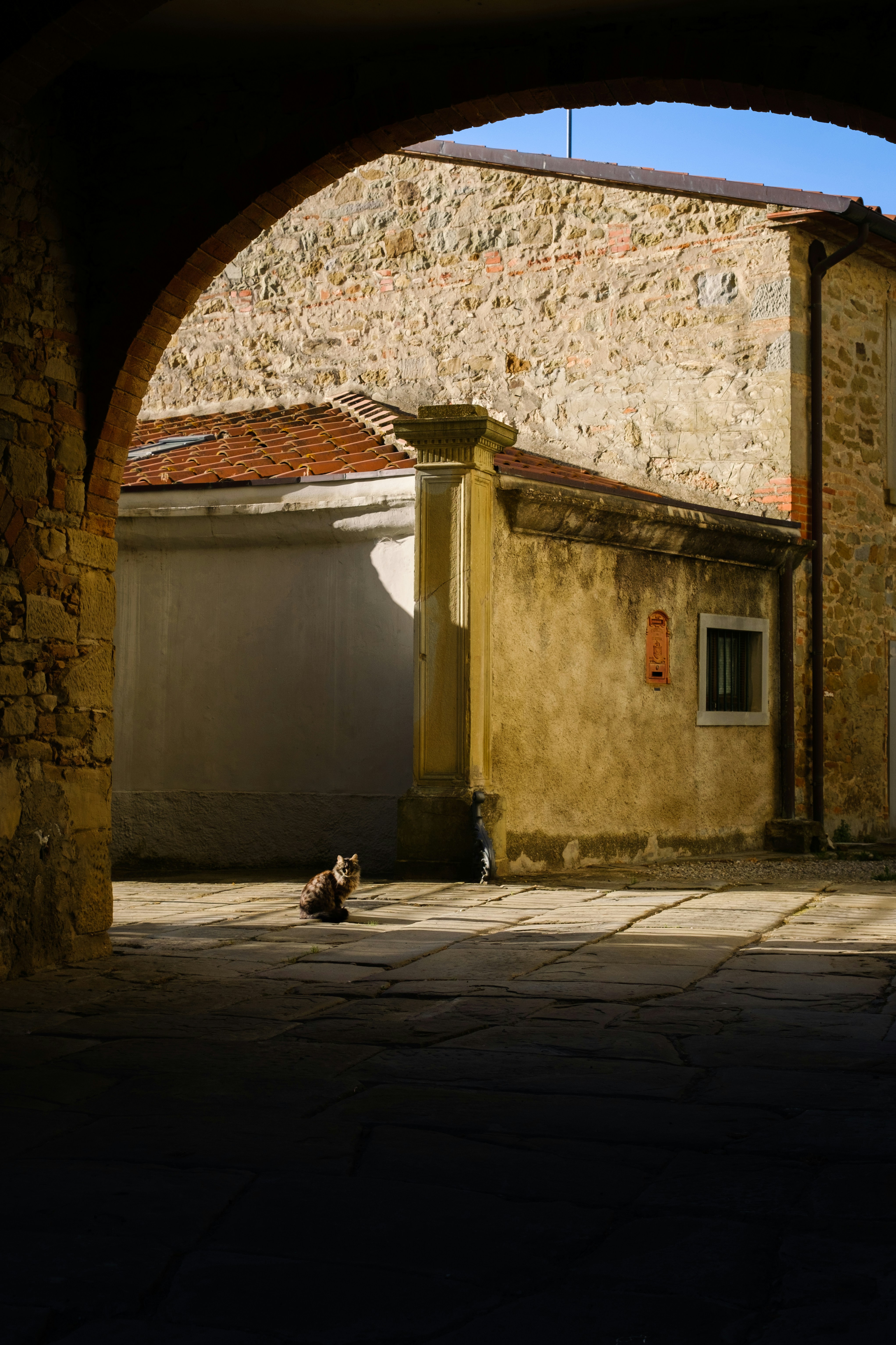 Whispers of Light in an Ancient Alleyway
