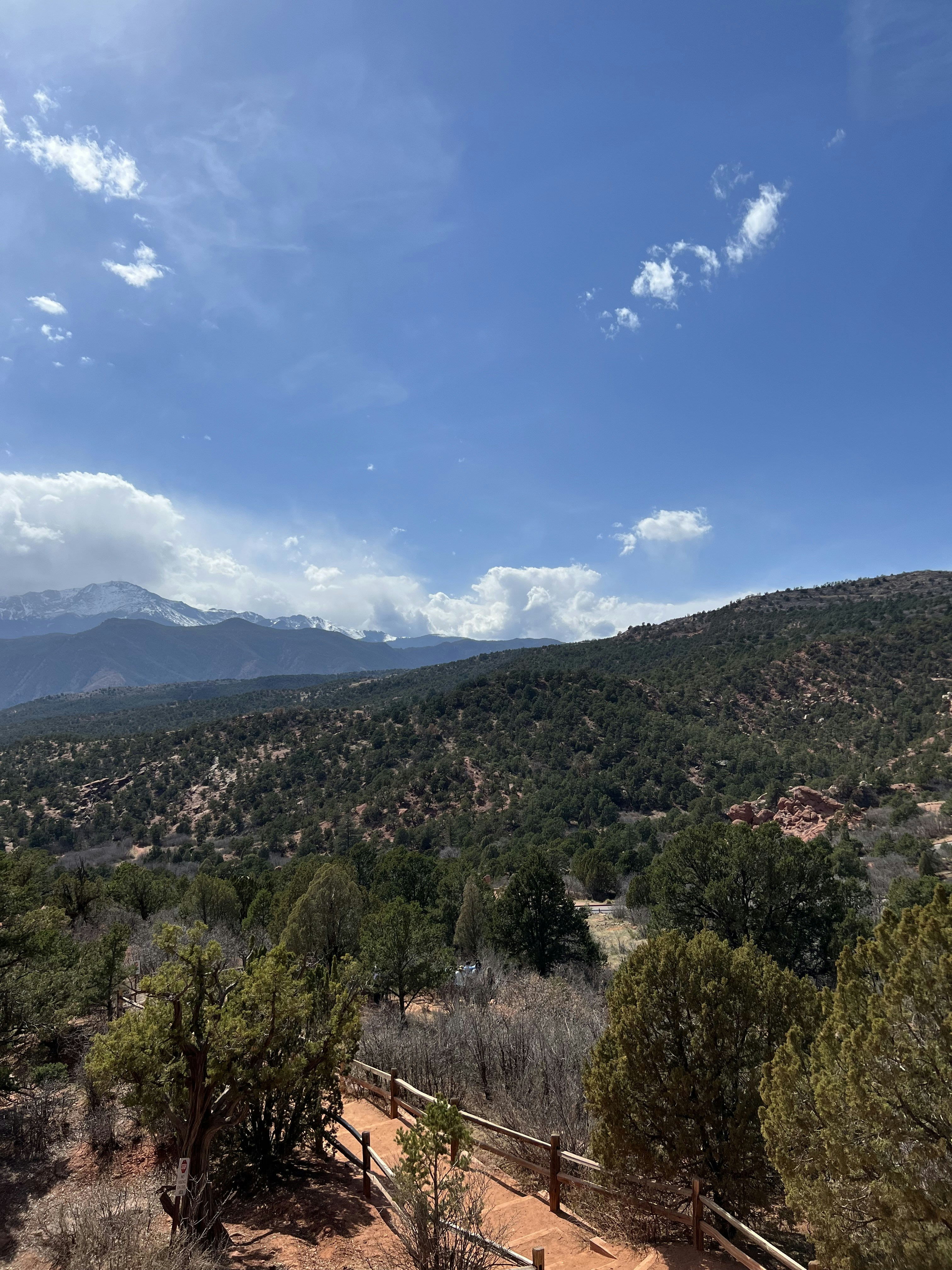 Quiet Ridge Overlook: A Sunlit Path Toward Snowy Peaks