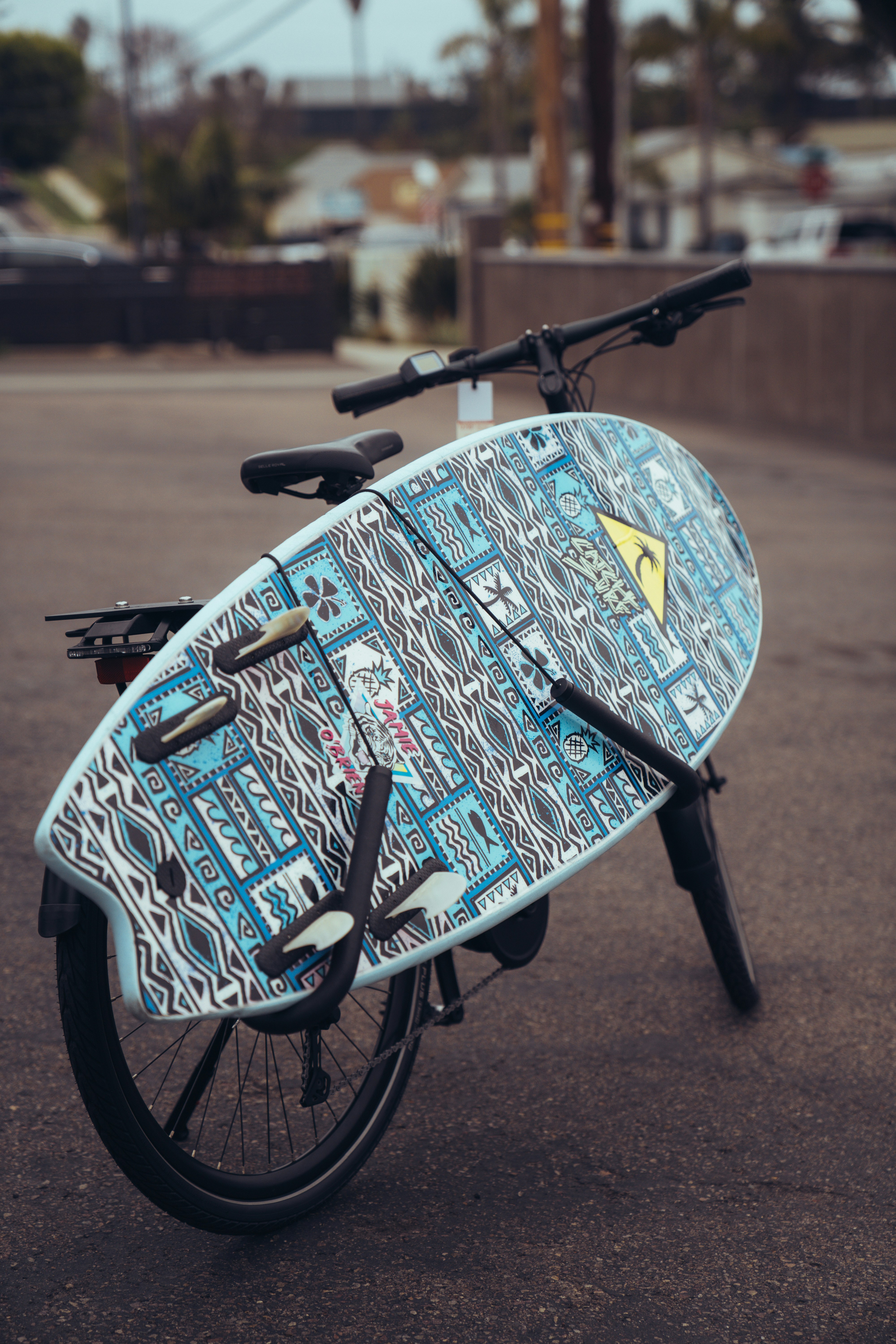 A surfboard strapped to the back of a bicycle photo – Free Del mar ...