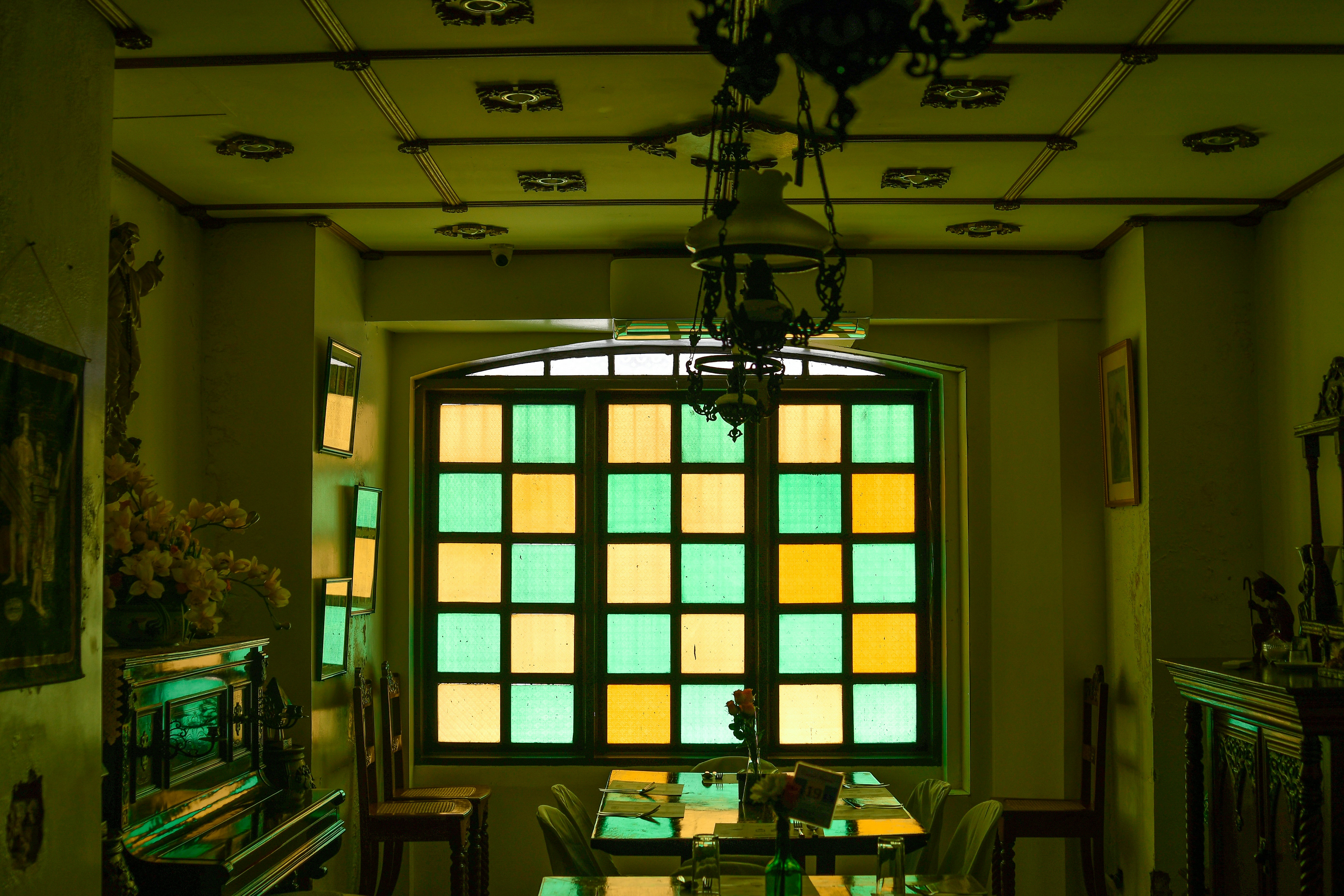 A room with a large window and a chandelier photo – Free Vigan Image on ...