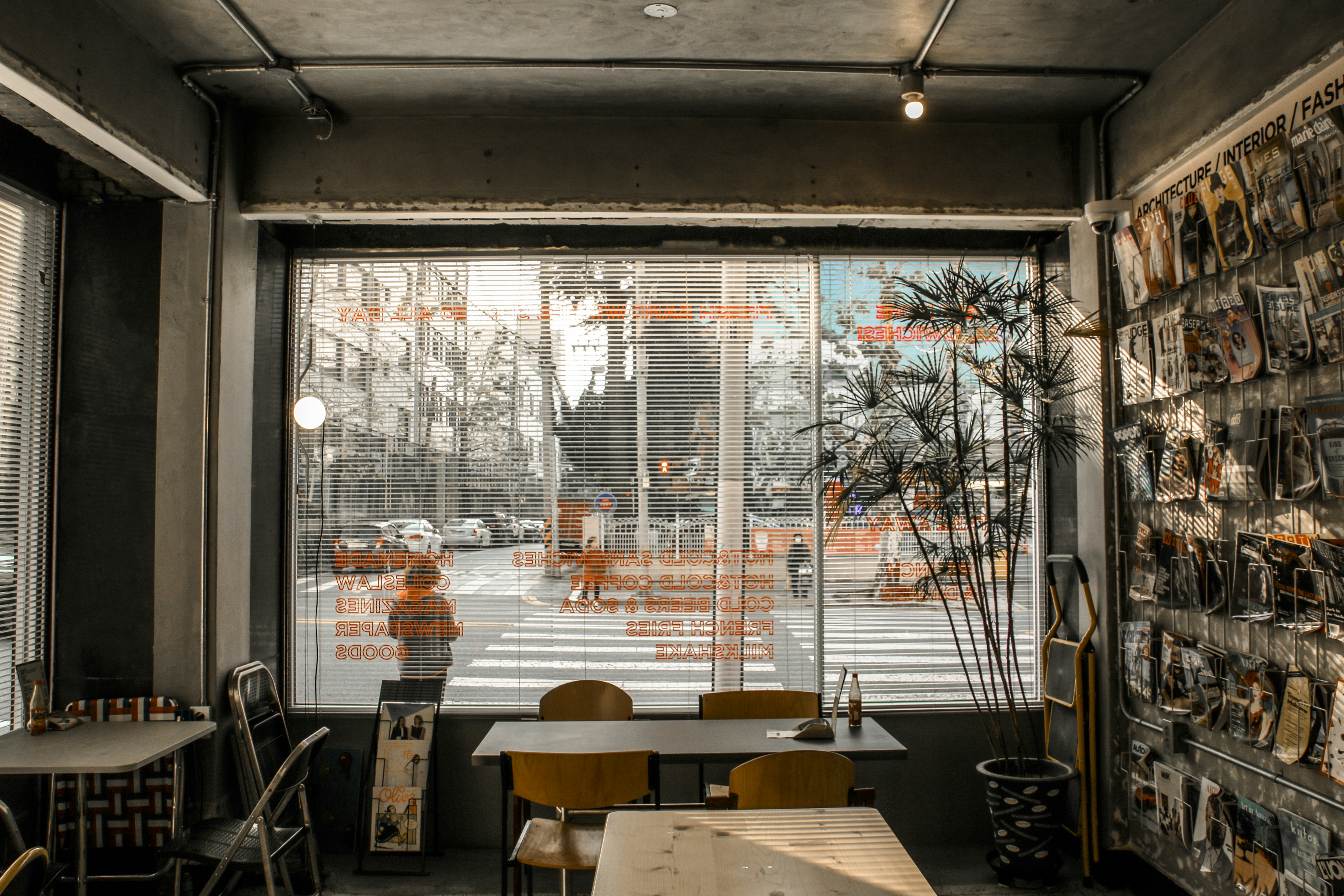 Glass-Front Café: Street Life Framed by Yellow Chairs