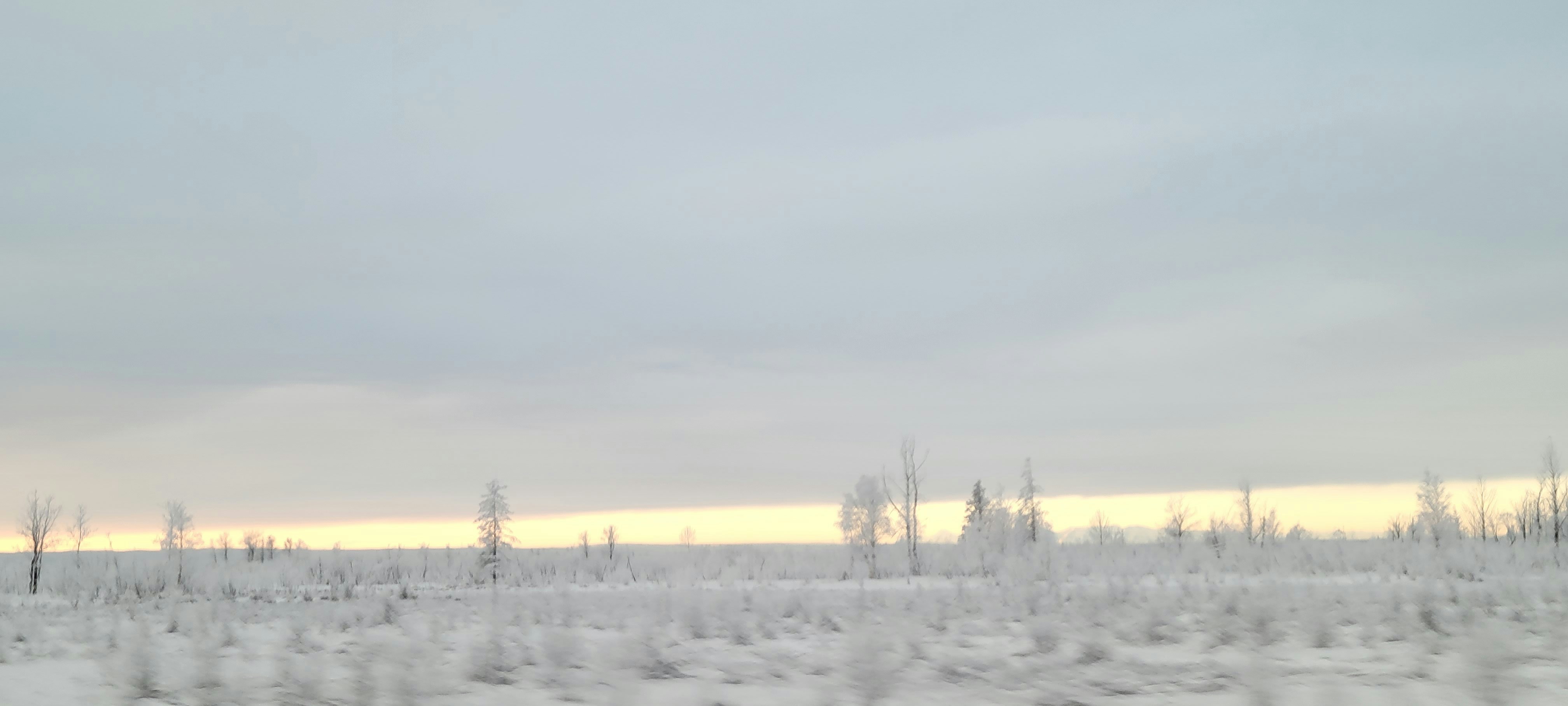 Dawn Edge over a Snow-Blanketed Plain