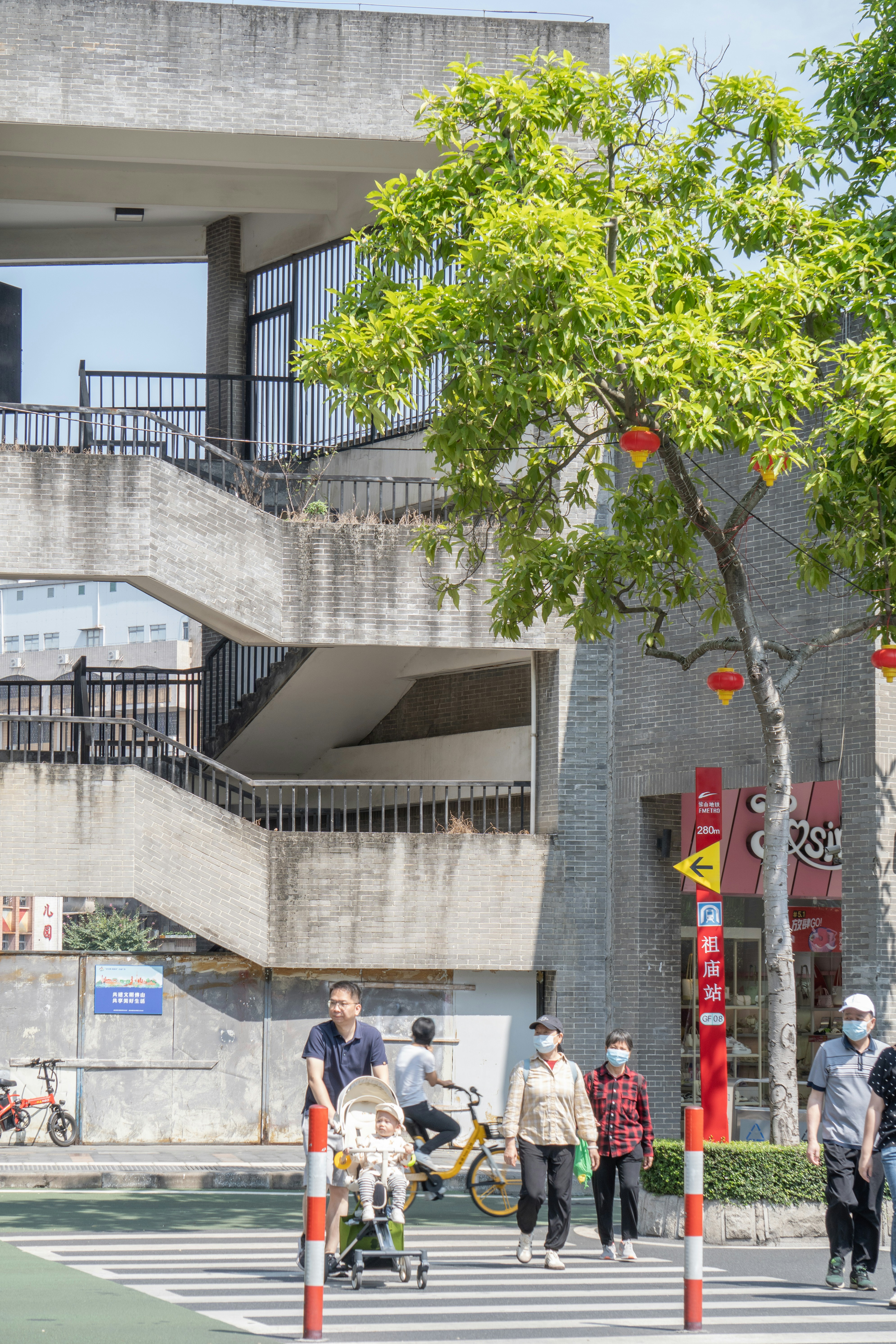 Brutalist Staircase Chronicle: Stroller Pause Under Red Lanterns