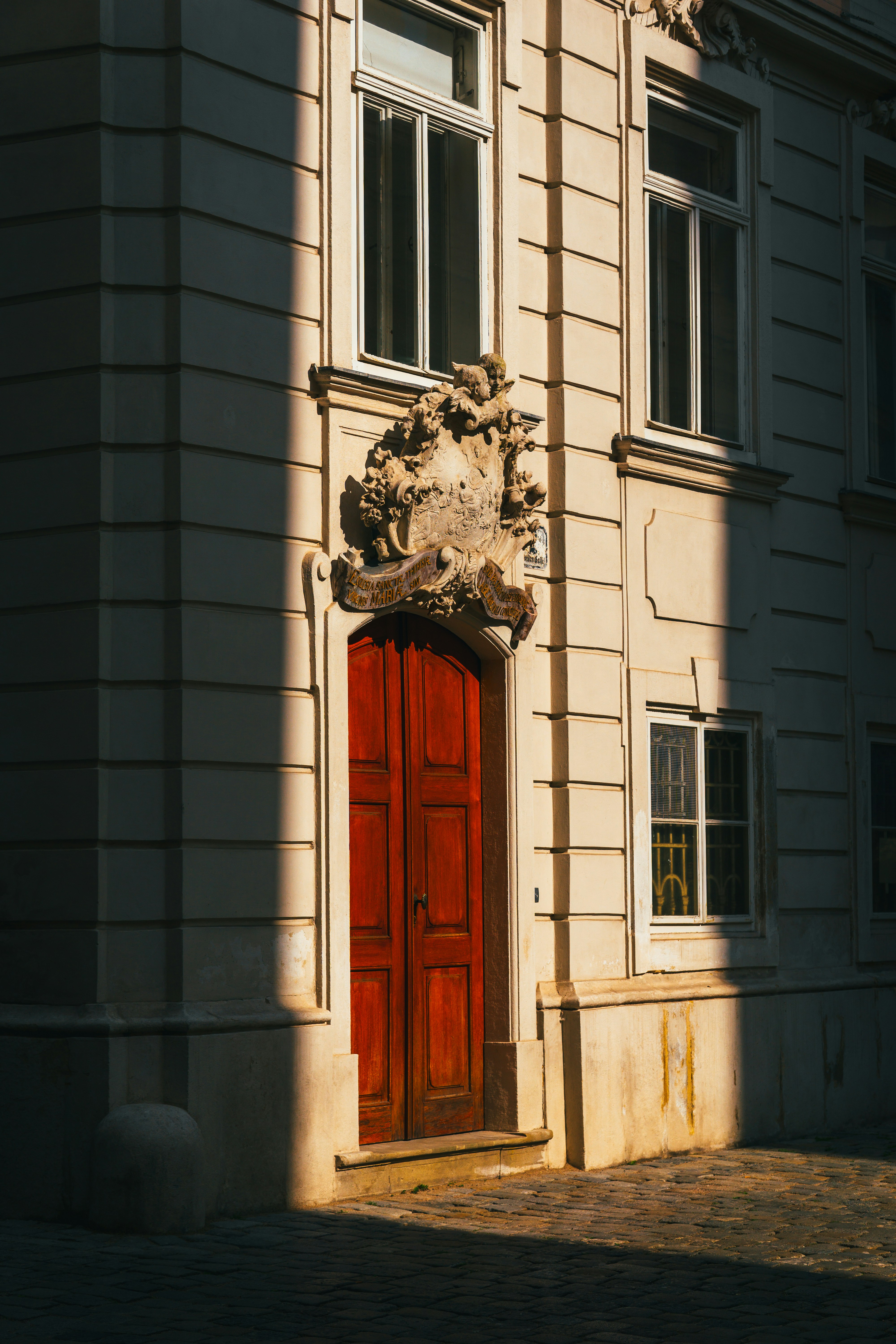 A large building with a red door and window photo – Free Austria Image ...
