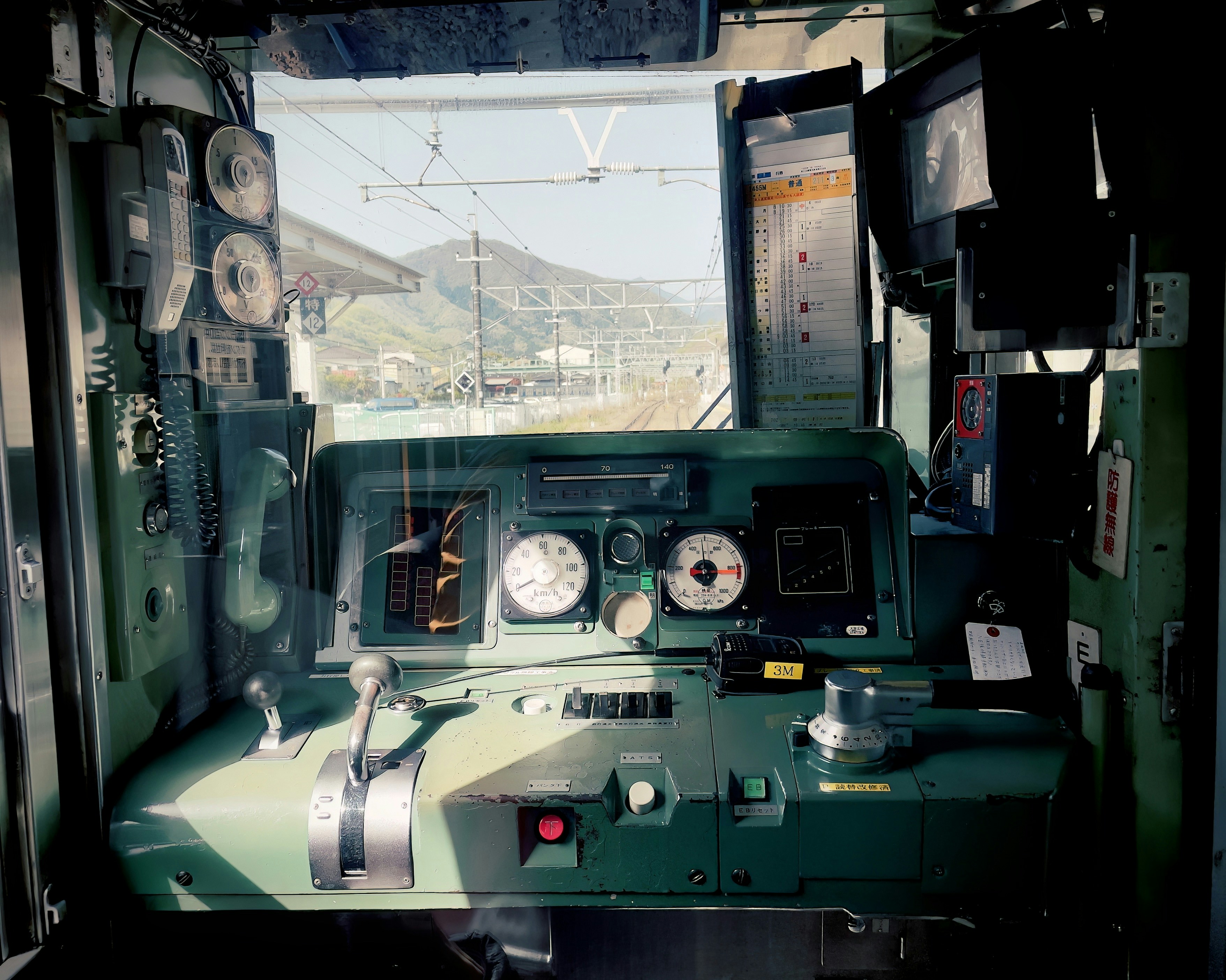 Inside a Green Locomotive Cab: Analog Gauges and a Quiet Horizon