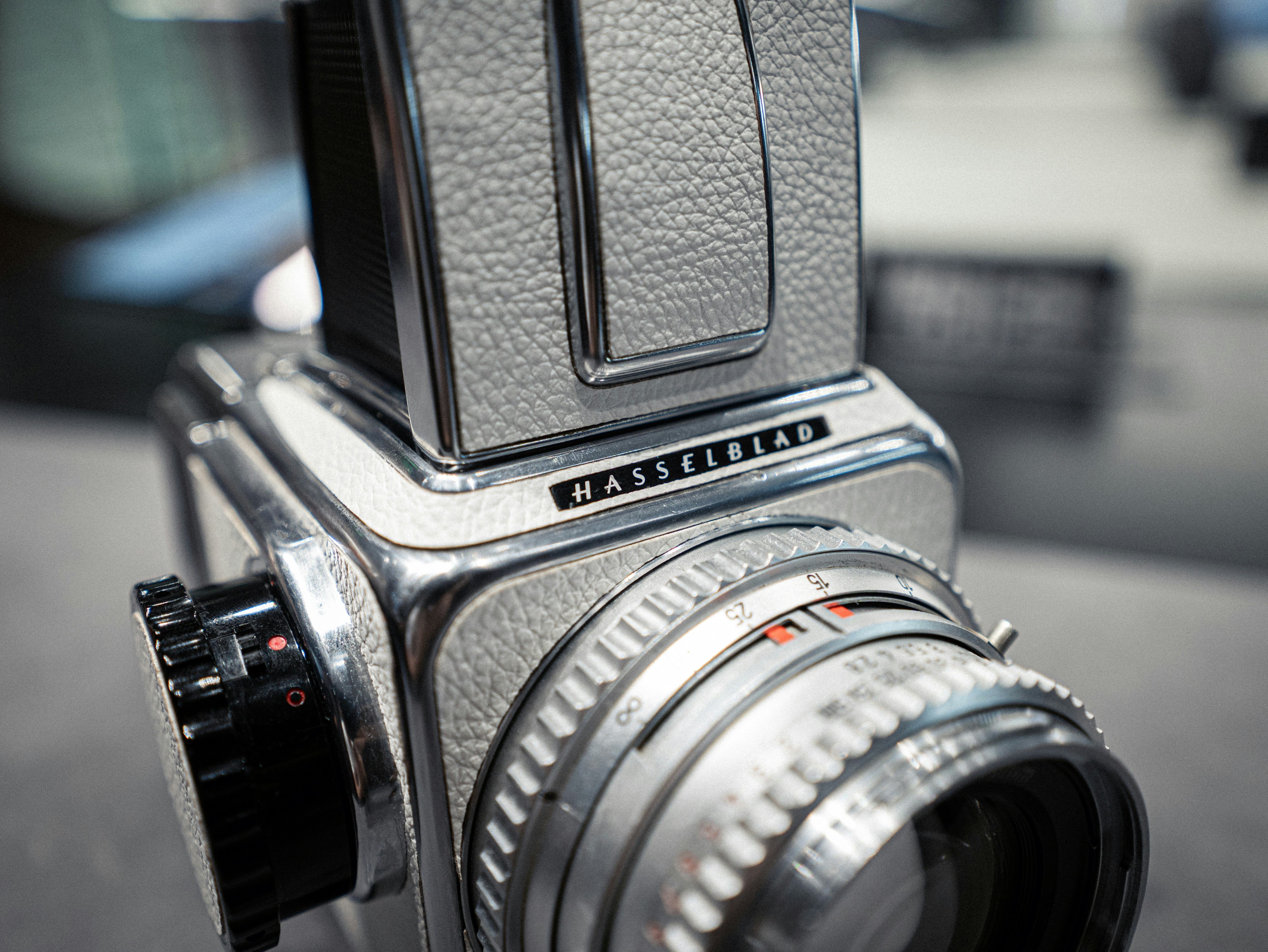 Industrial Chrome: Close-Up of a Hasselblad Camera's Textured Body and Lens