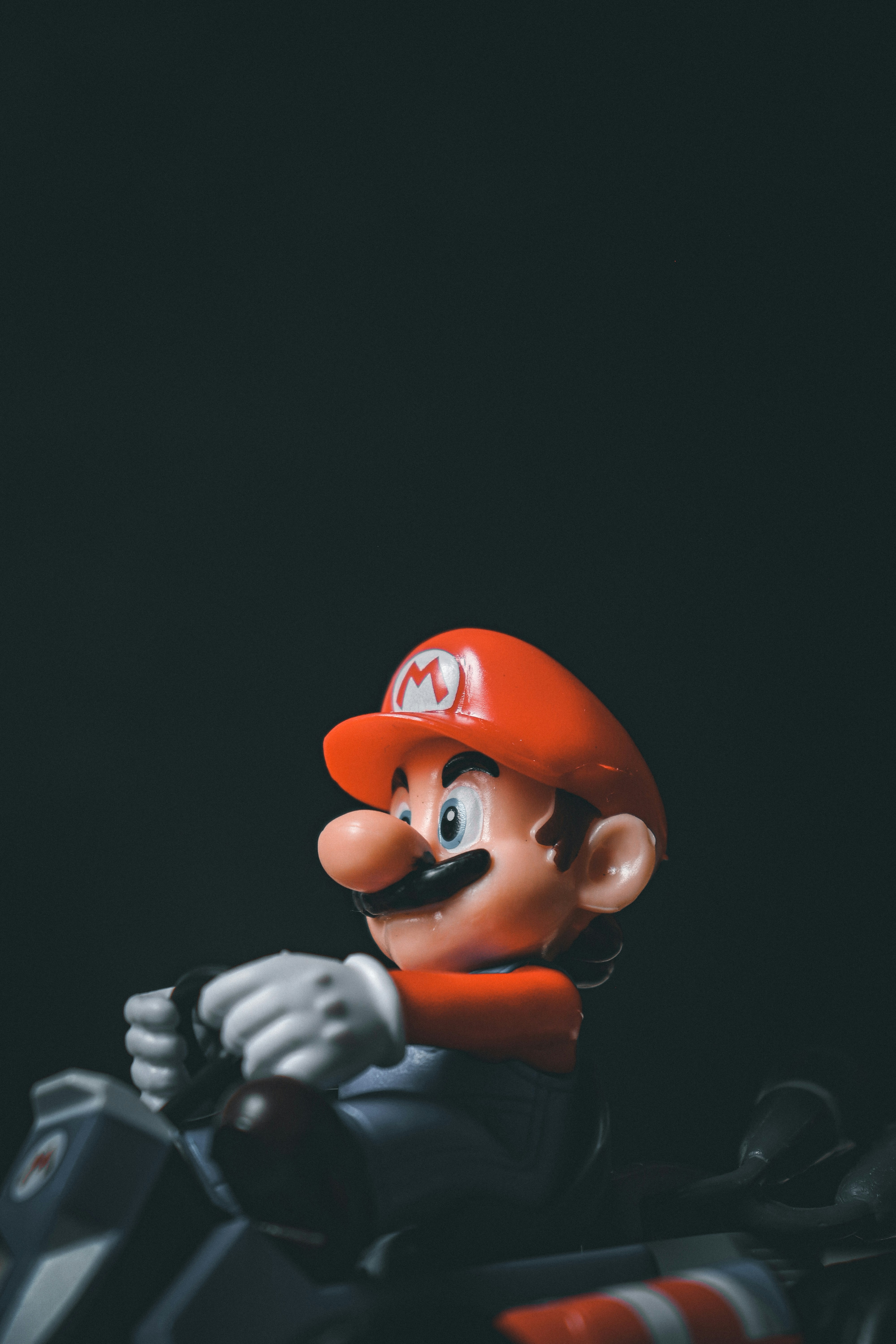 A mario kart figure sitting on top of a motorcycle photo – Free Cartoon ...