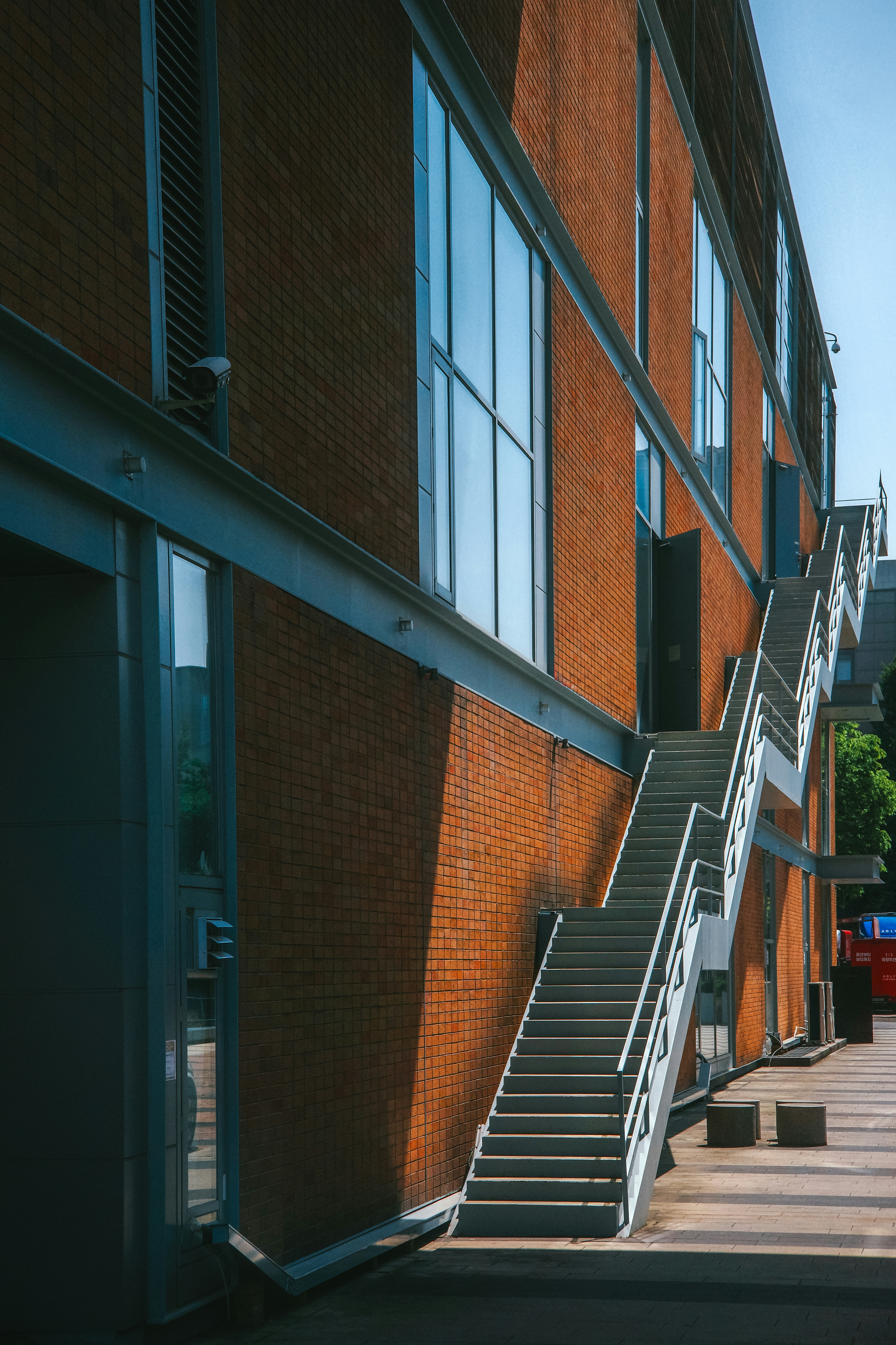 a brick building with a set of stairs next to it