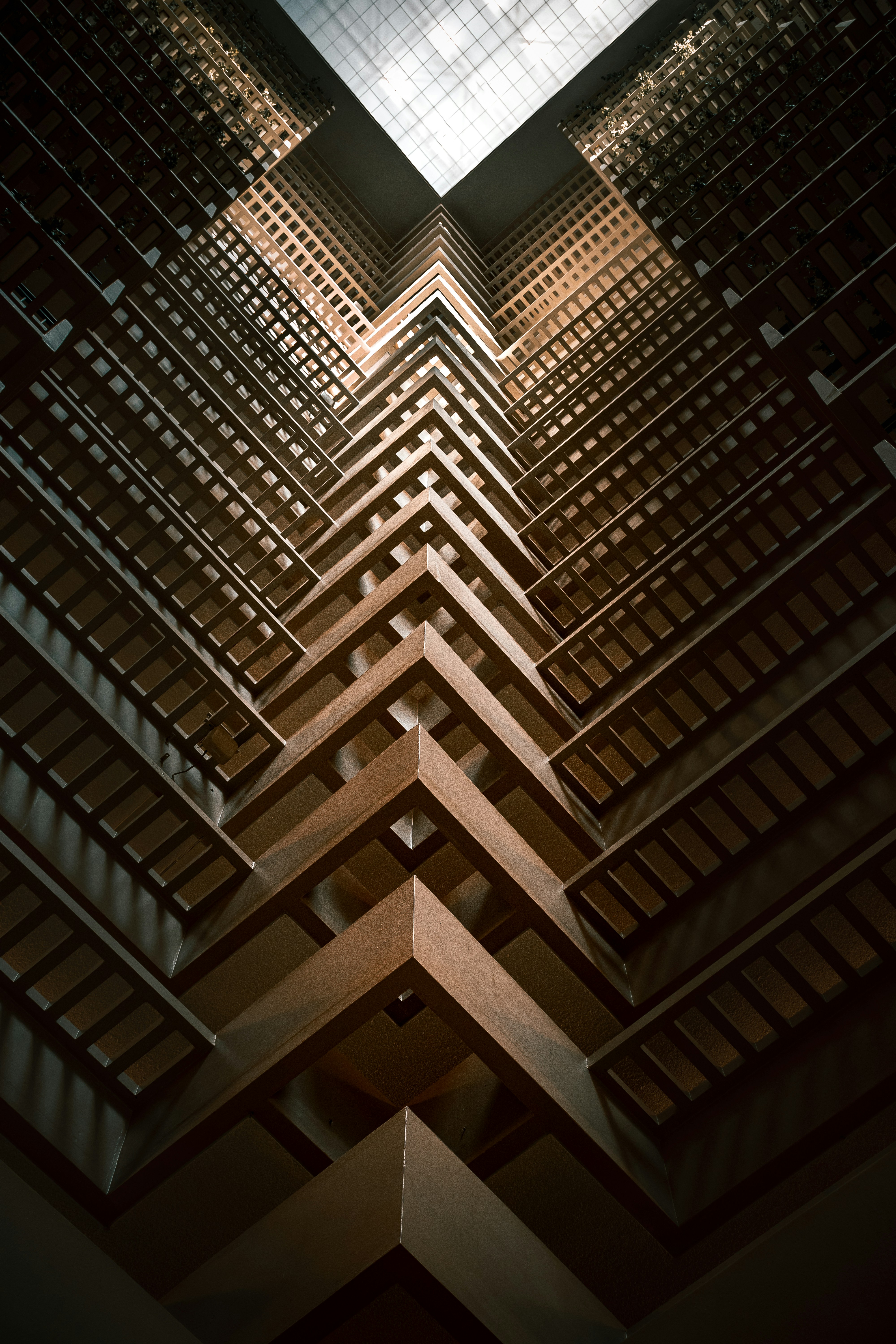 Vertigo of Angled Facades: The Atrium's Geometric Convergence