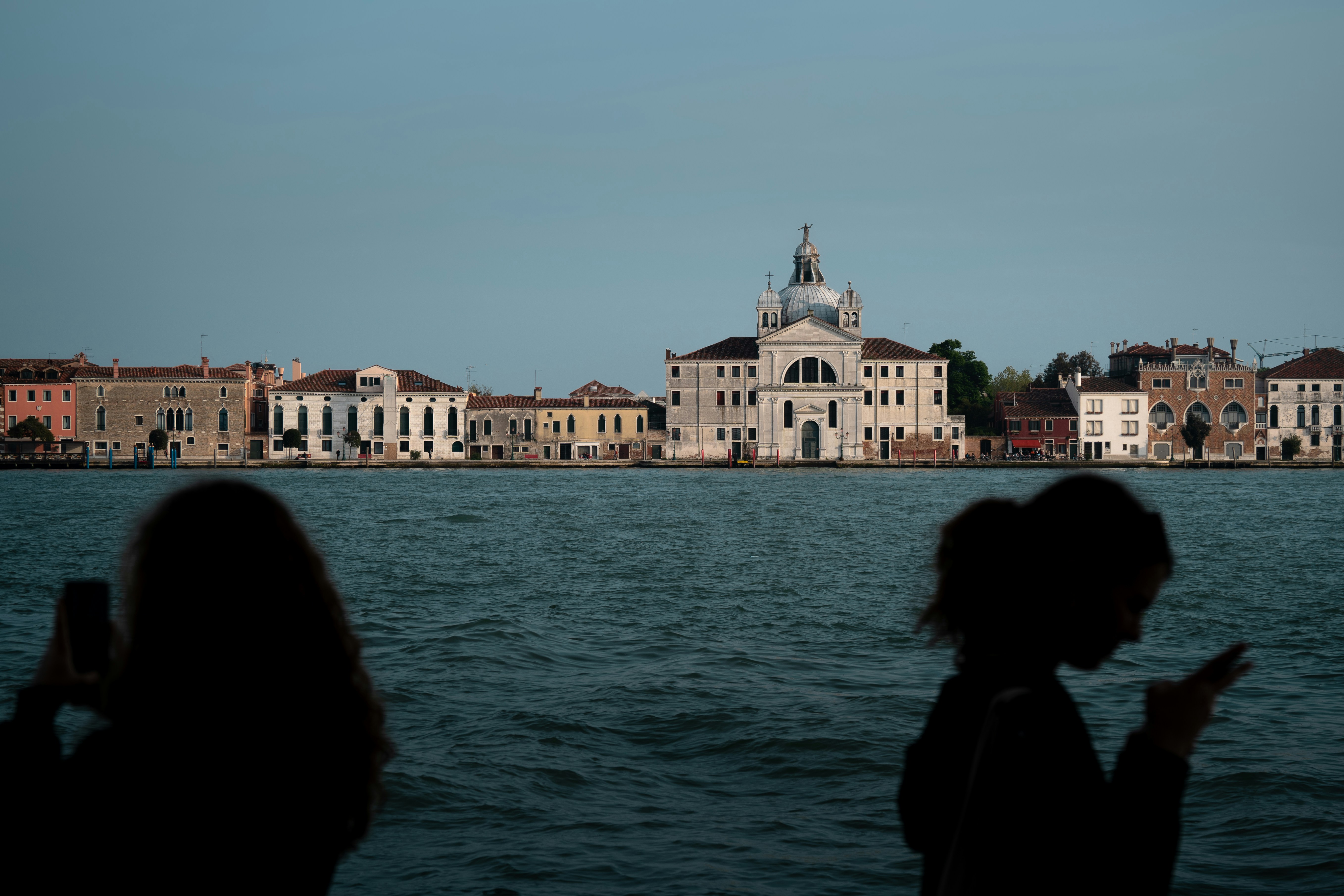 Silhouettes Over the Venetian Waterfront at Dusk