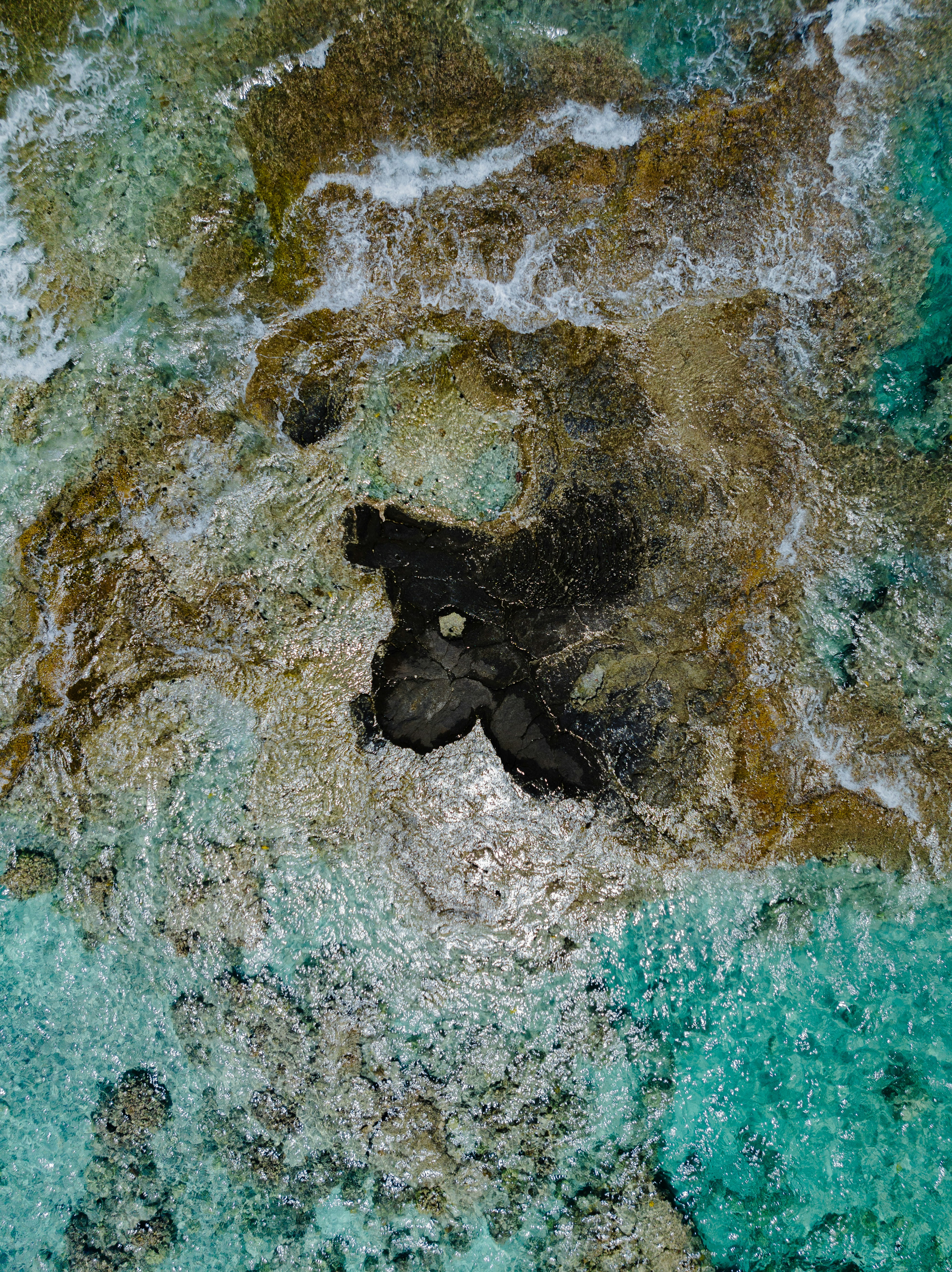 Sunken Caldera Blues: Aerial View of Turquoise Thermal Pools
