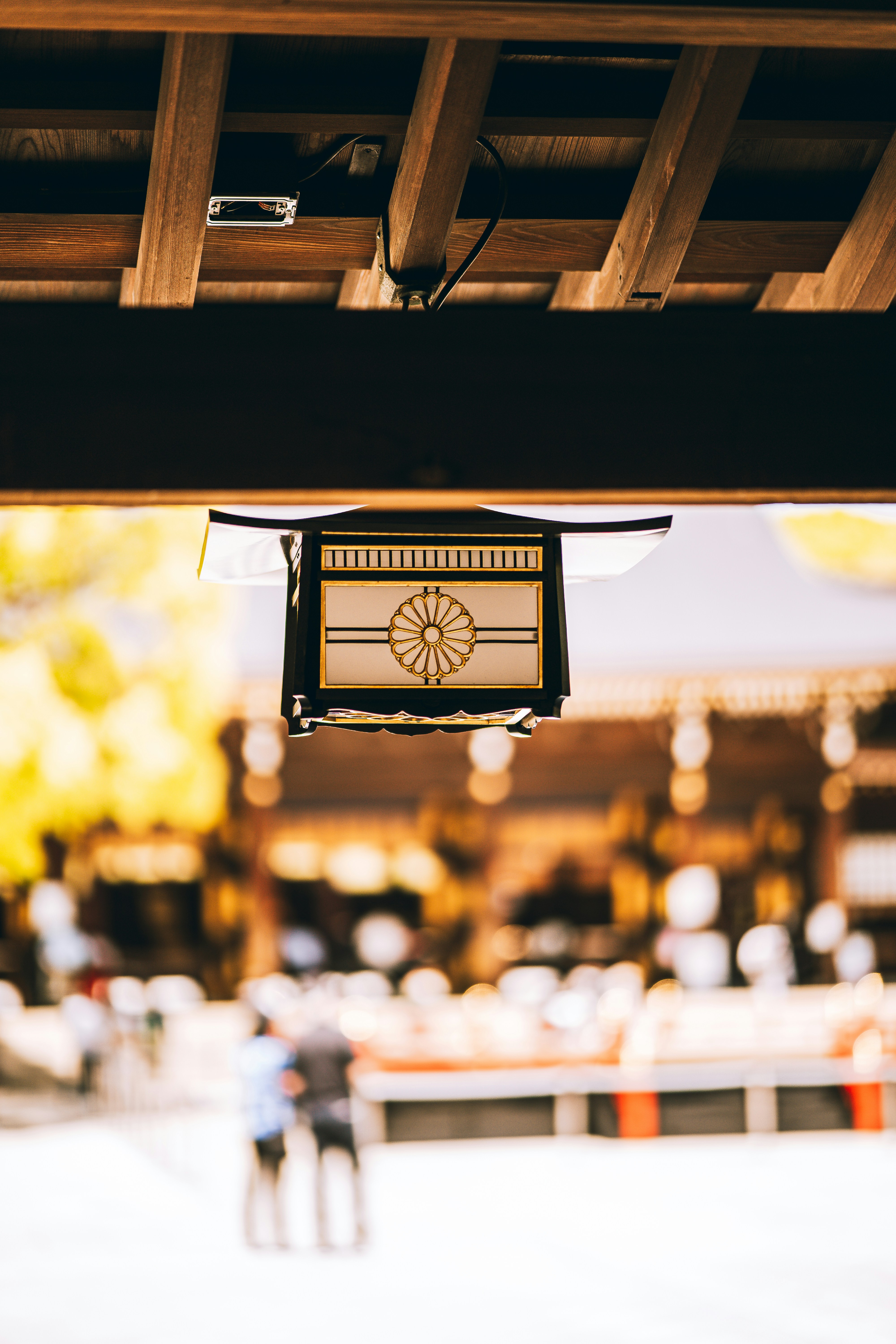 A clock hanging from the ceiling of a building photo – Free Tokyo Image ...