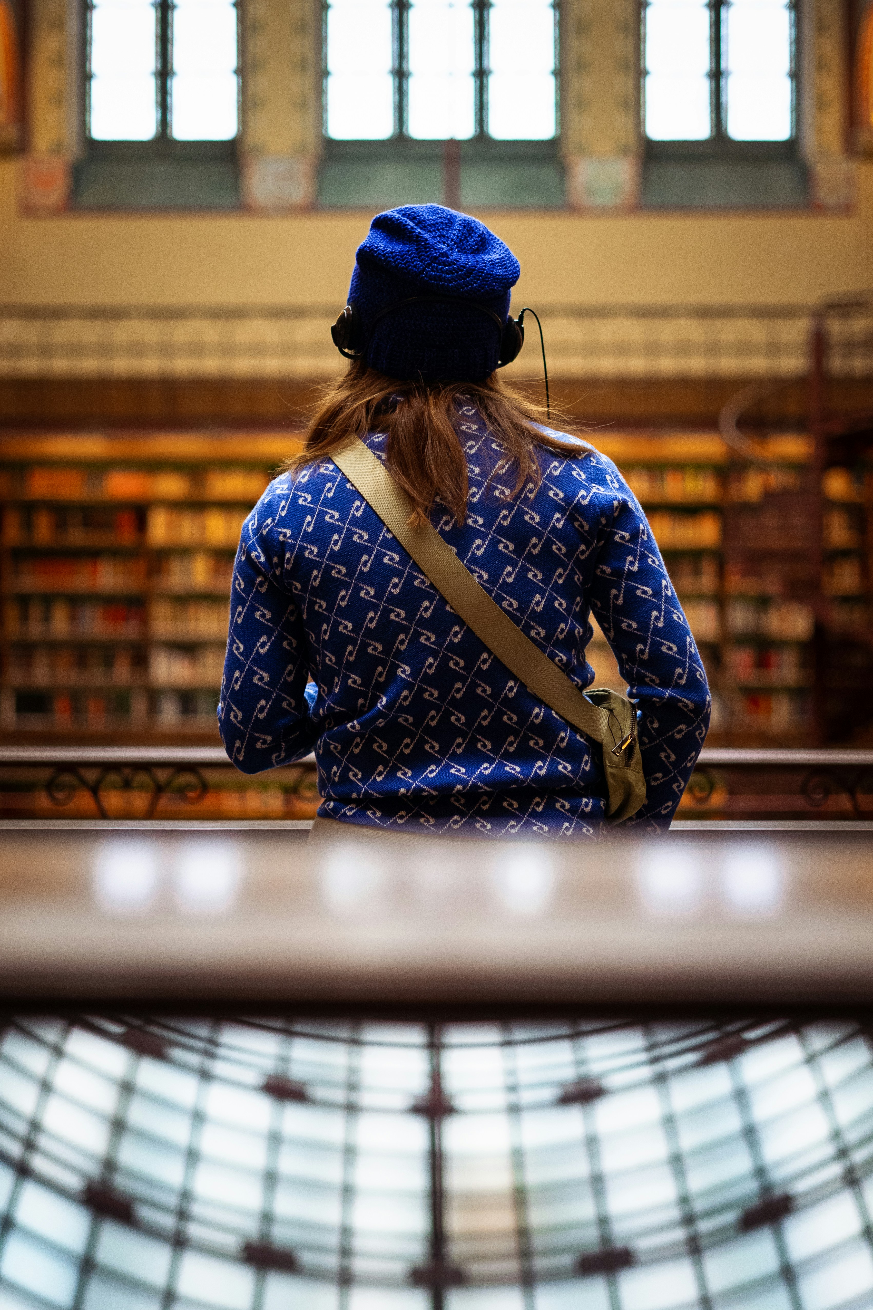 Blue Attire in a Library Atrium