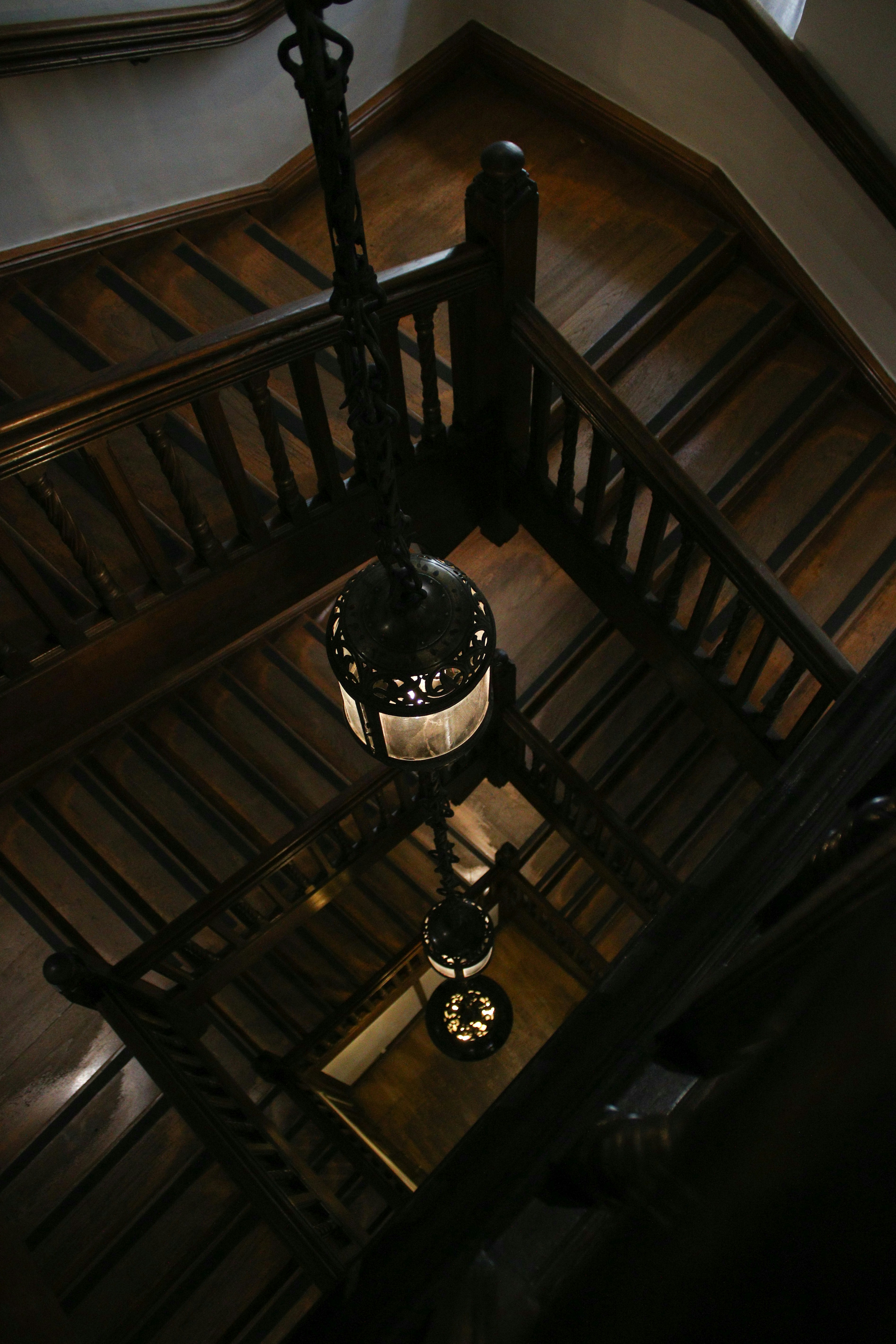 Descending Iron Lanterns: A Dim Victorian Stairwell