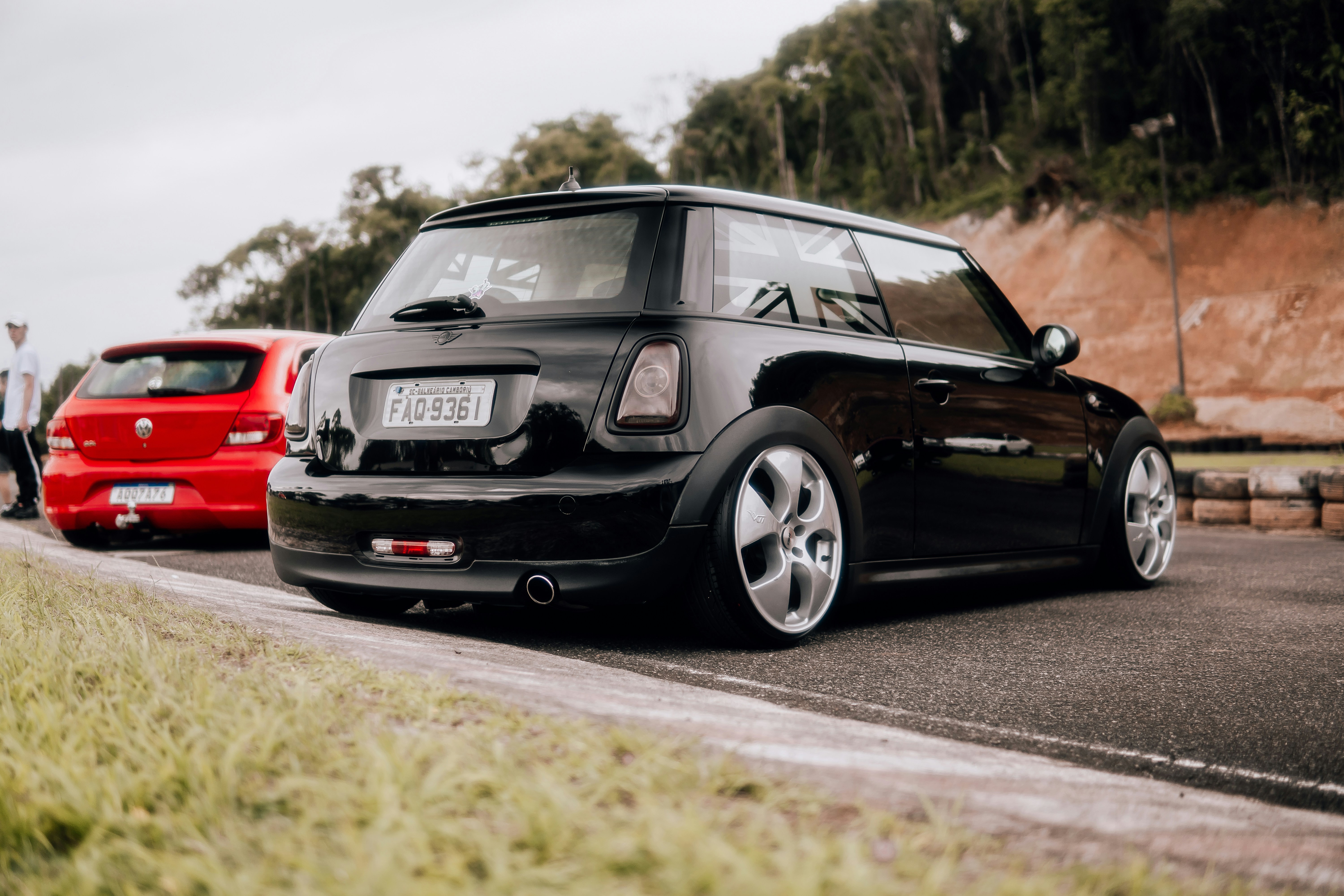 A small black car parked on the side of the road photo – Free Brasil ...