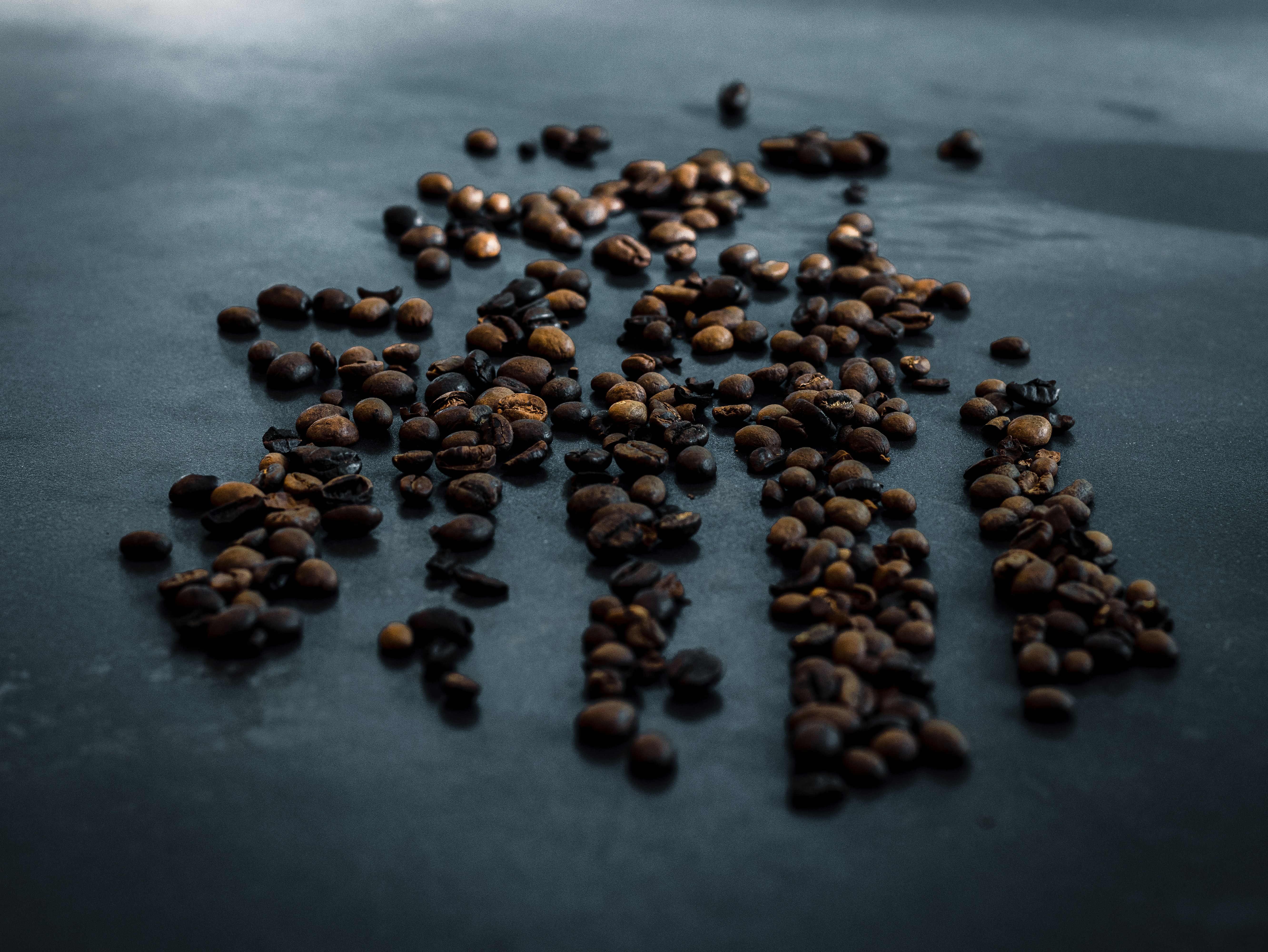 Midnight Mosaic: A Quiet Scatter of Coffee Beans on a Velvet-Dark Surface