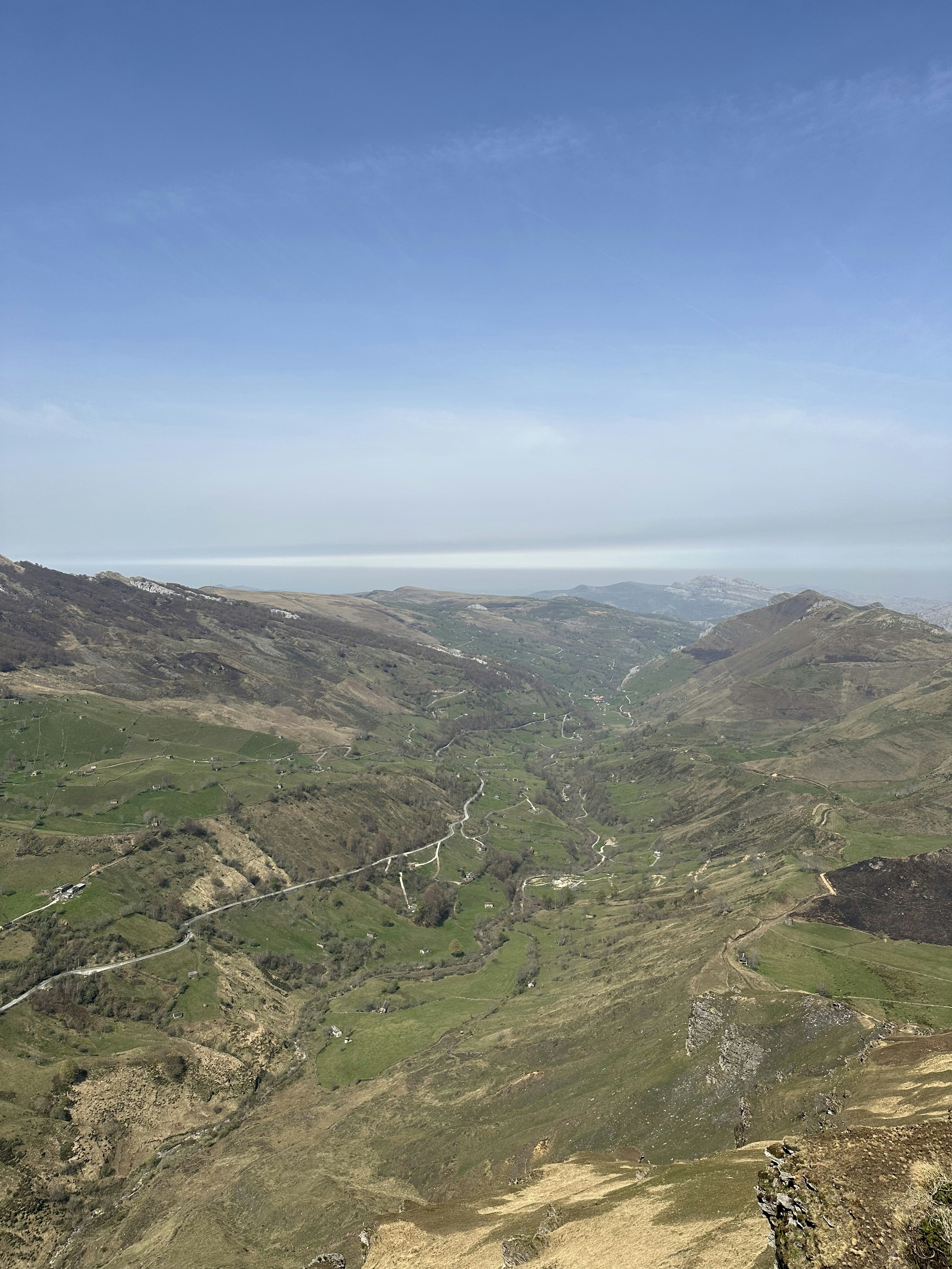 Terraced Valleys Reaching Toward a Distant Sea