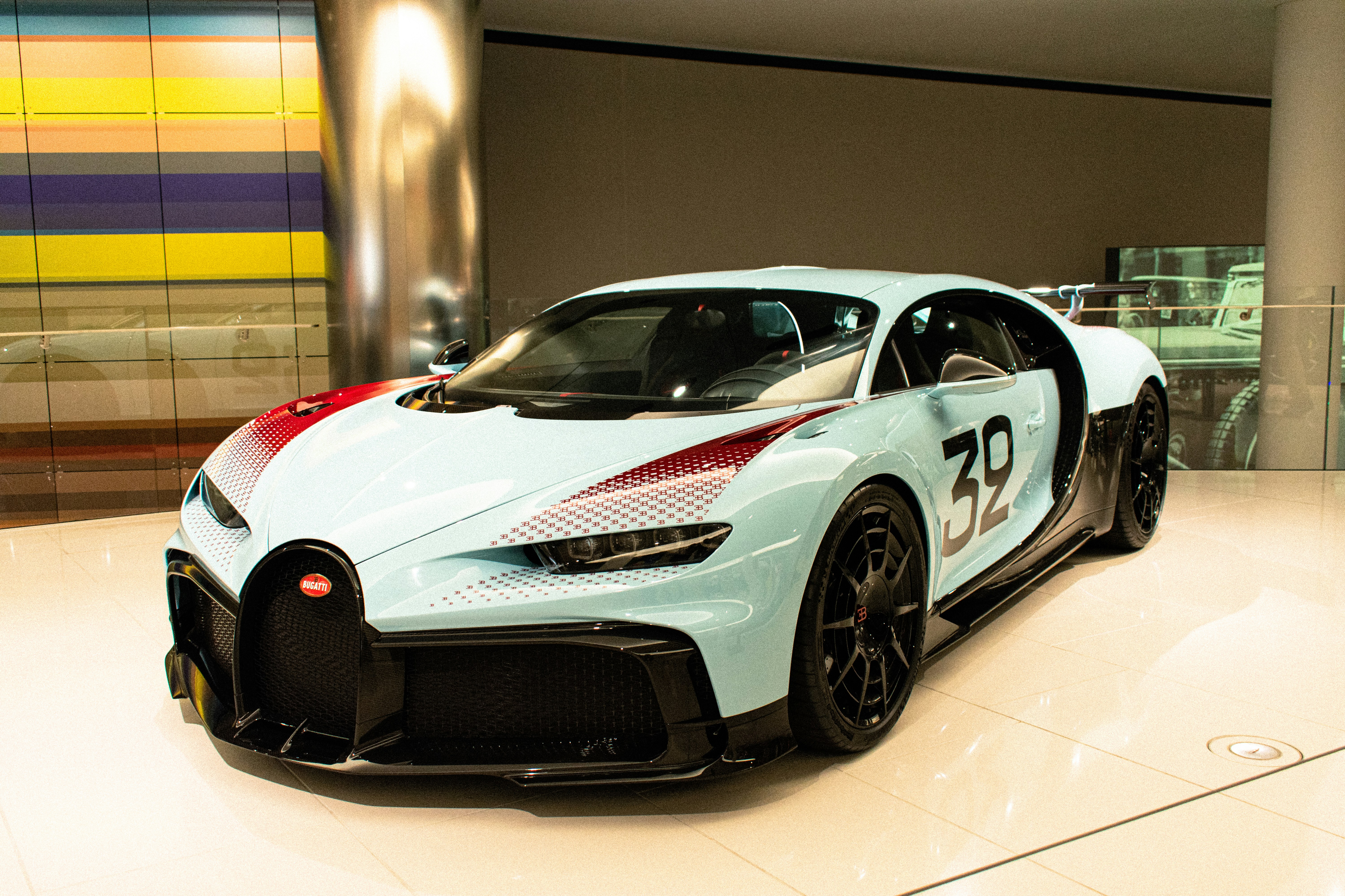 A bugatti type car on display in a building photo – Free Car Image on ...