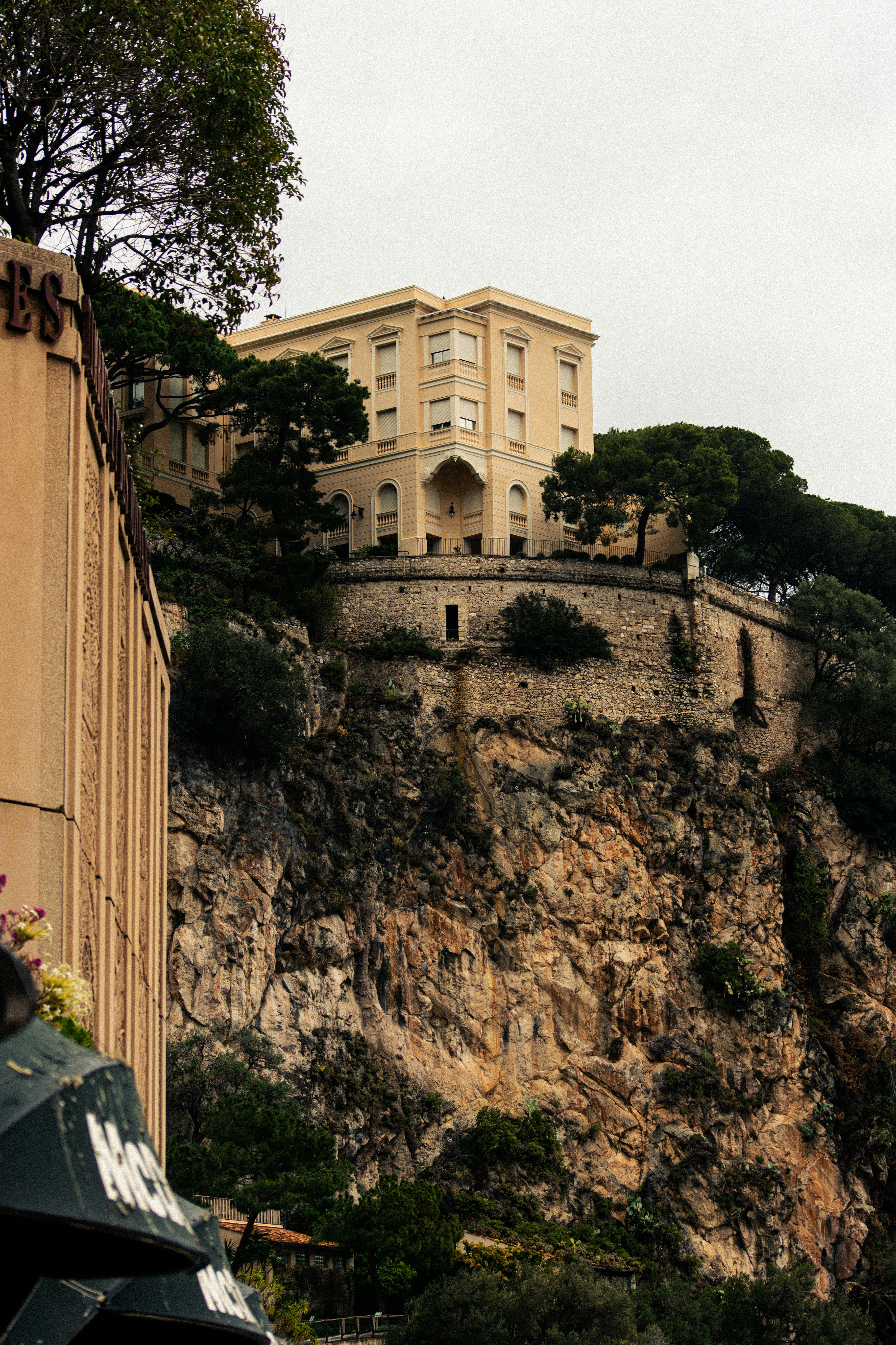 Cliffside Villa: a pale mansion perched above a rugged limestone bluff