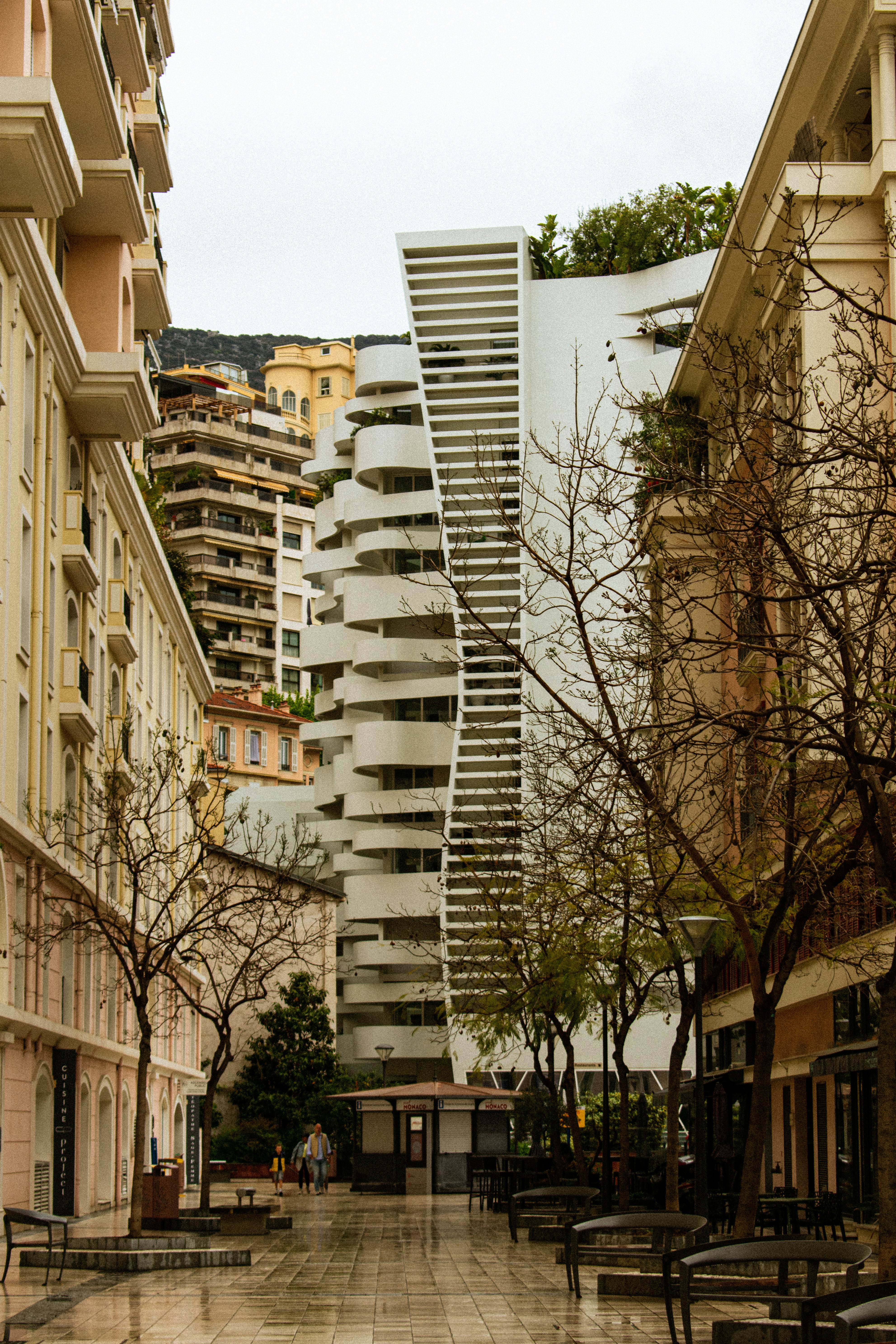 Vertical Lattice Rising: A Modern White Tower Framed by Historic Streets