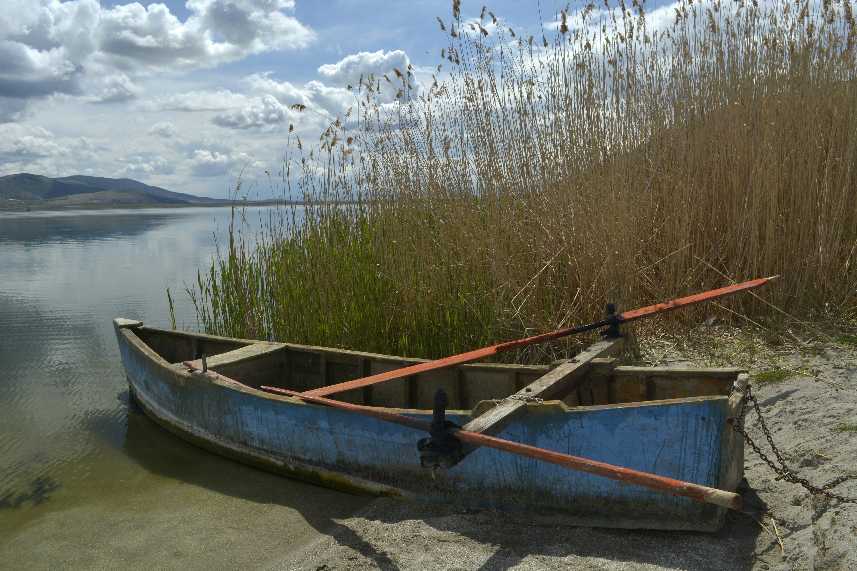 I decided to shoot this lonely fisherman boat at the shore of Vegoritida lake. The lake was calm and I sensed tranquility during the shoot. Tripod to ensure focus to the last cloud in the sky.