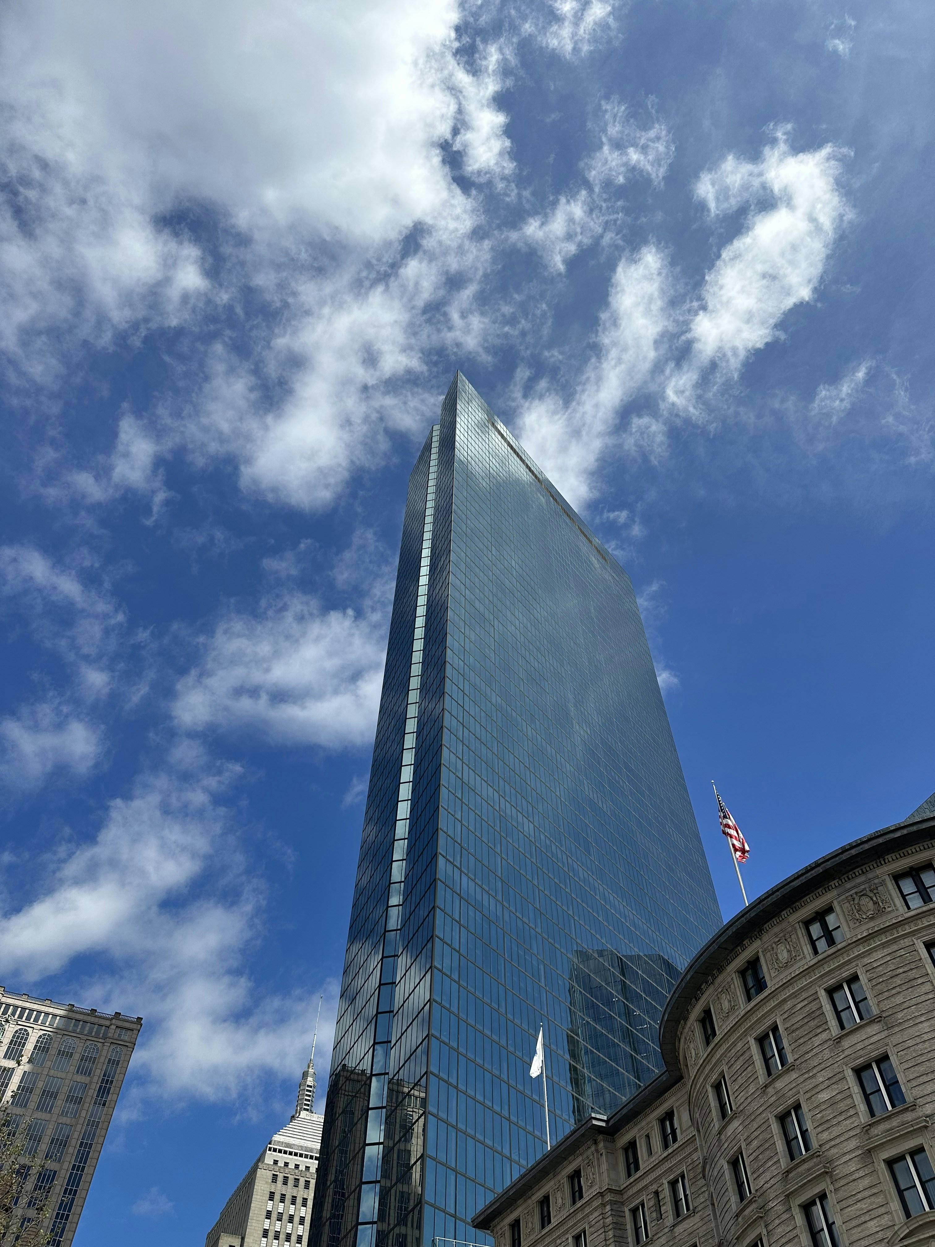 Shard of the Skyline: Glass Tower Reaching into an Open Blue Sky