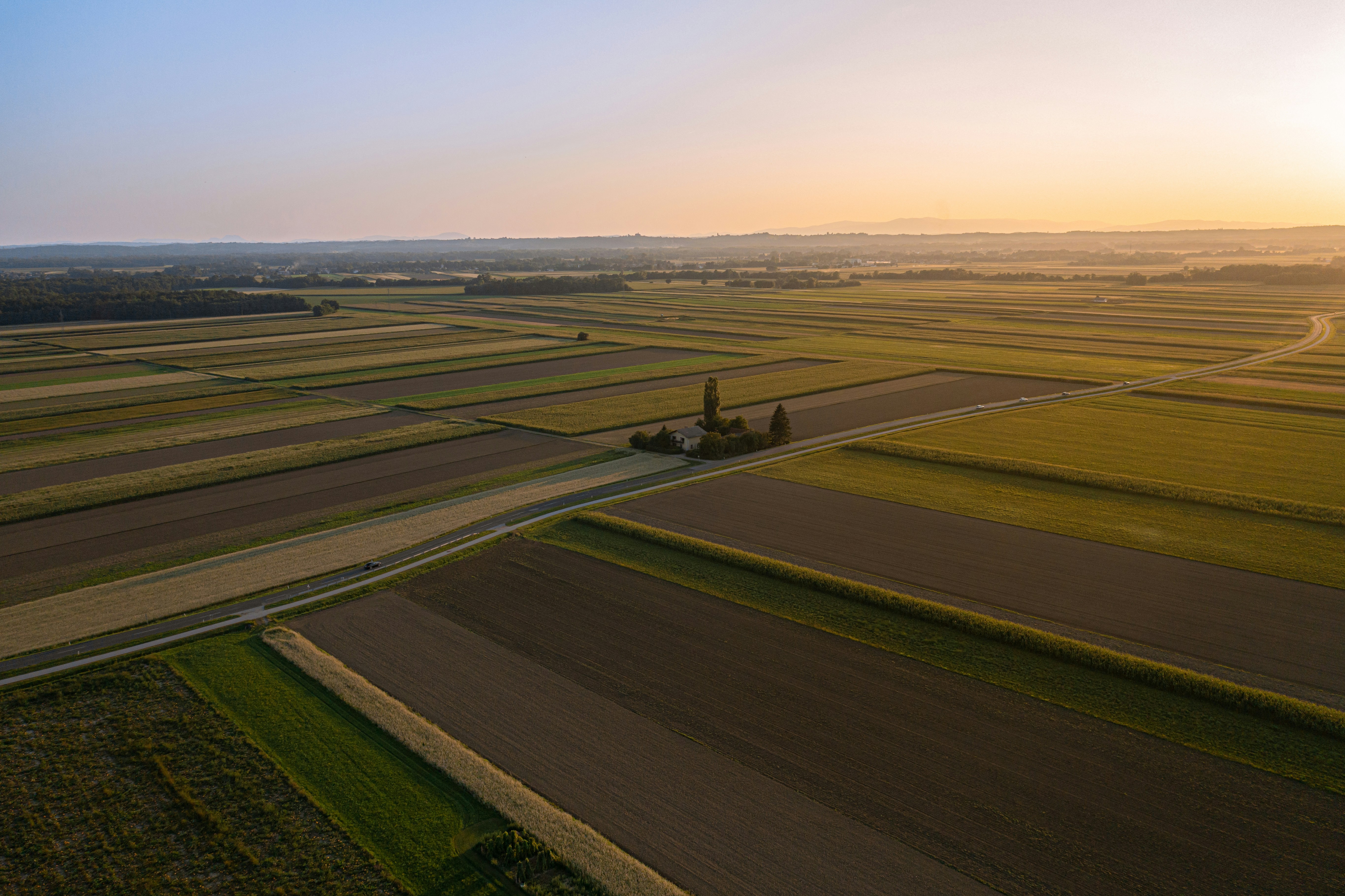 An aerial view of a farm field at sunset photo – Free Prekmurje Image ...