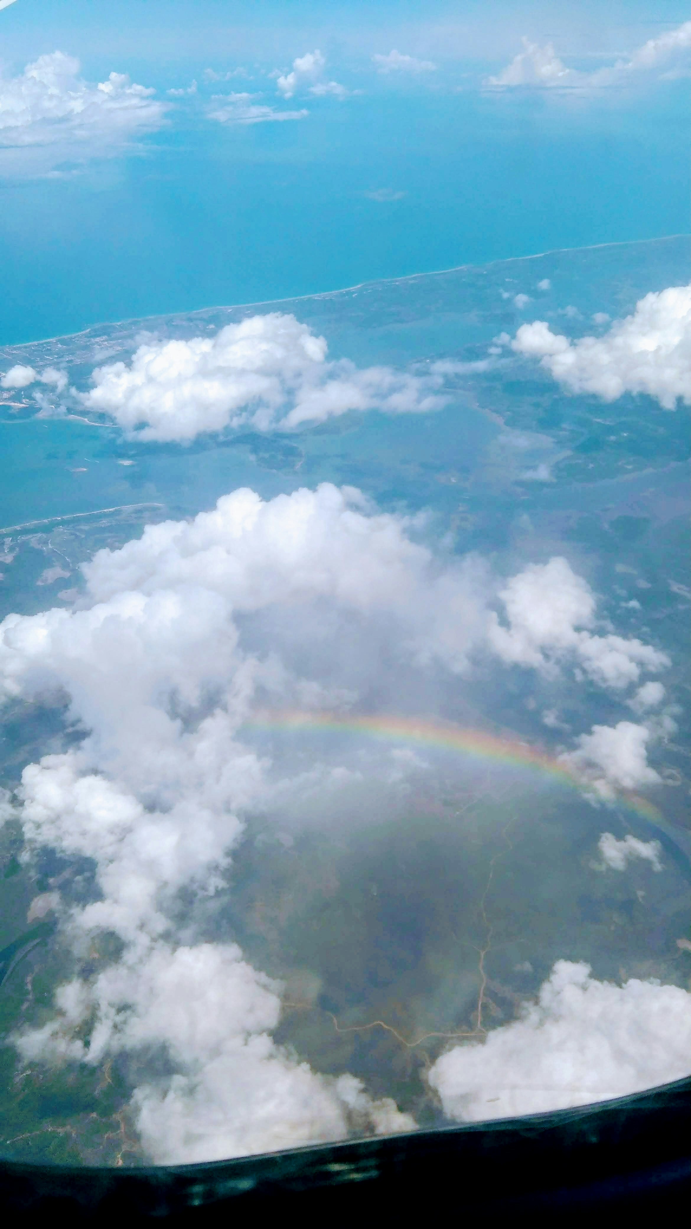 A view of a rainbow from an airplane window photo – Free Image on Unsplash