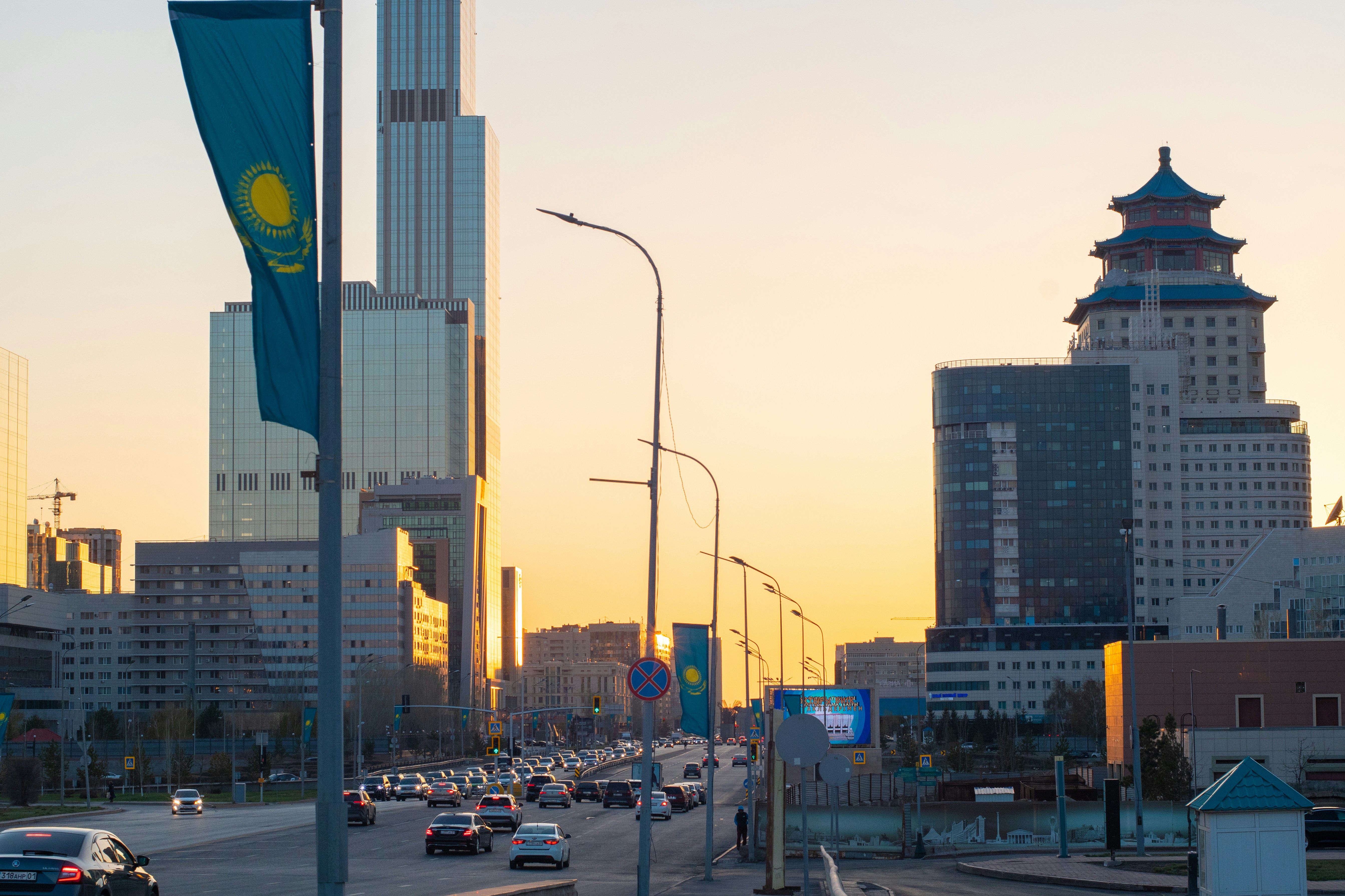 Dusk Boulevard: Glass Giants and a Pagoda-Topped Skyline