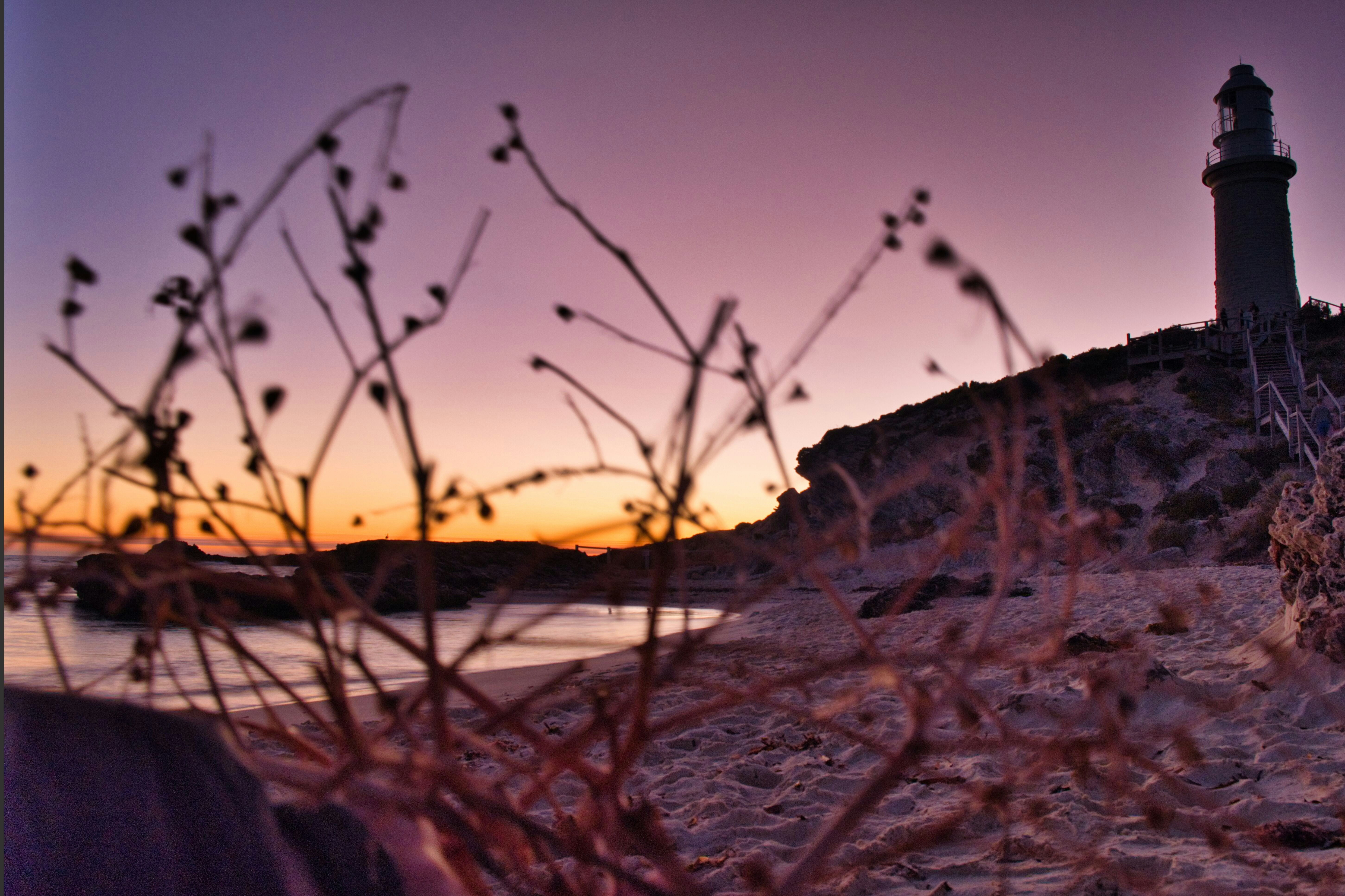 Lighthouse Veil at Dusk: Textured Sands and Silhouetted Keep