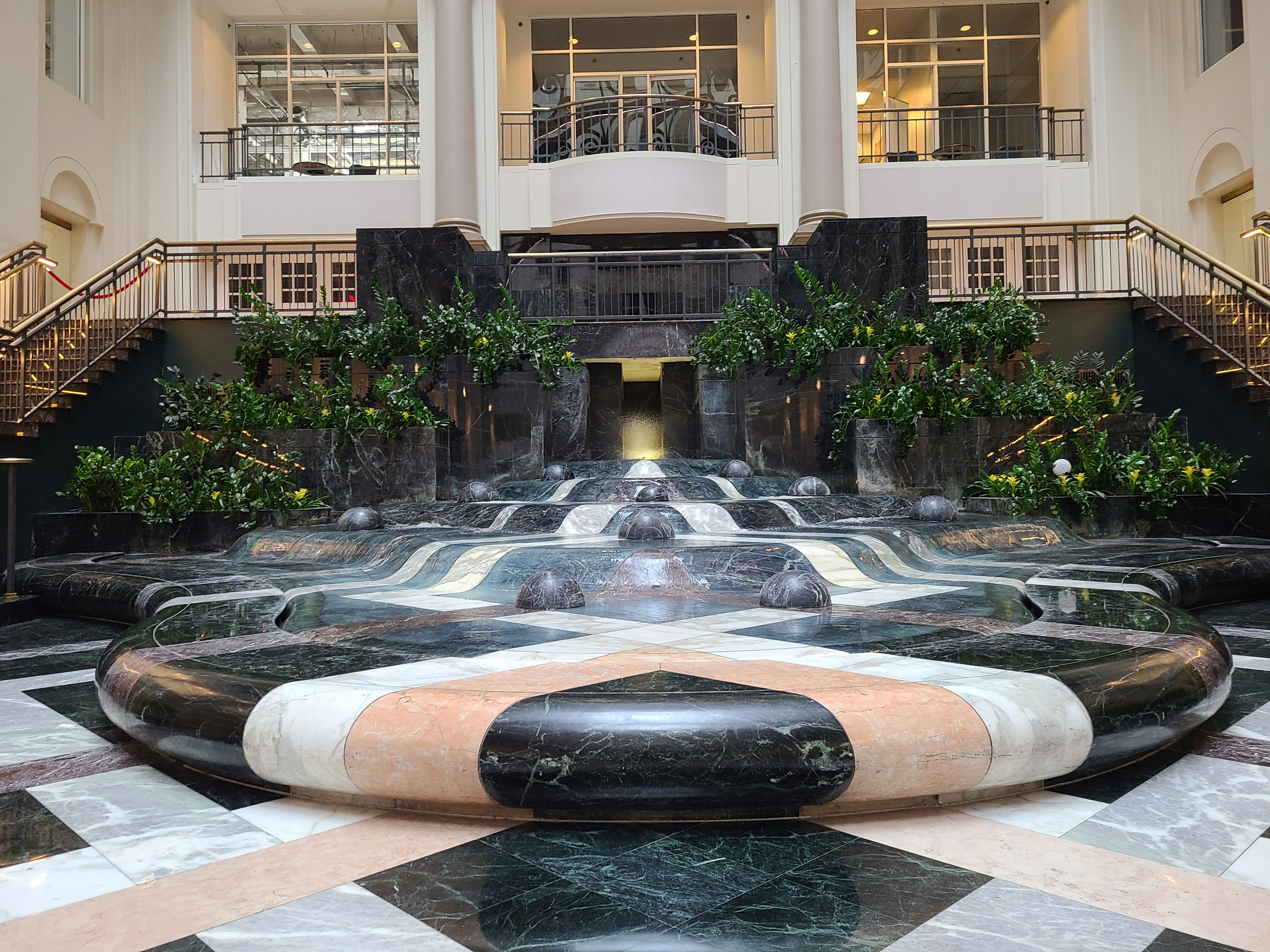 Circular marble ripples in an opulent atrium fountain
