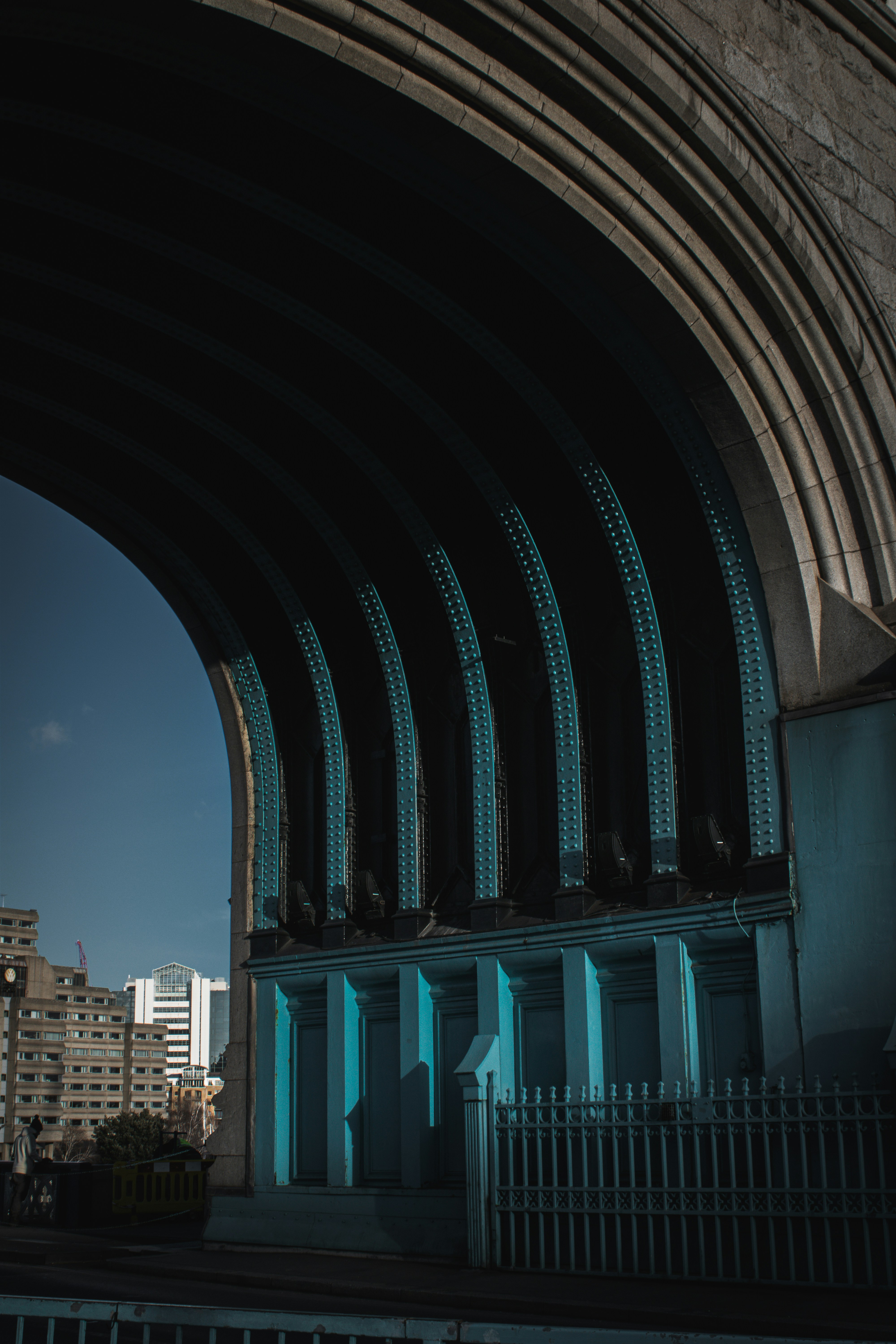 Teal Arches Framing the Distant City