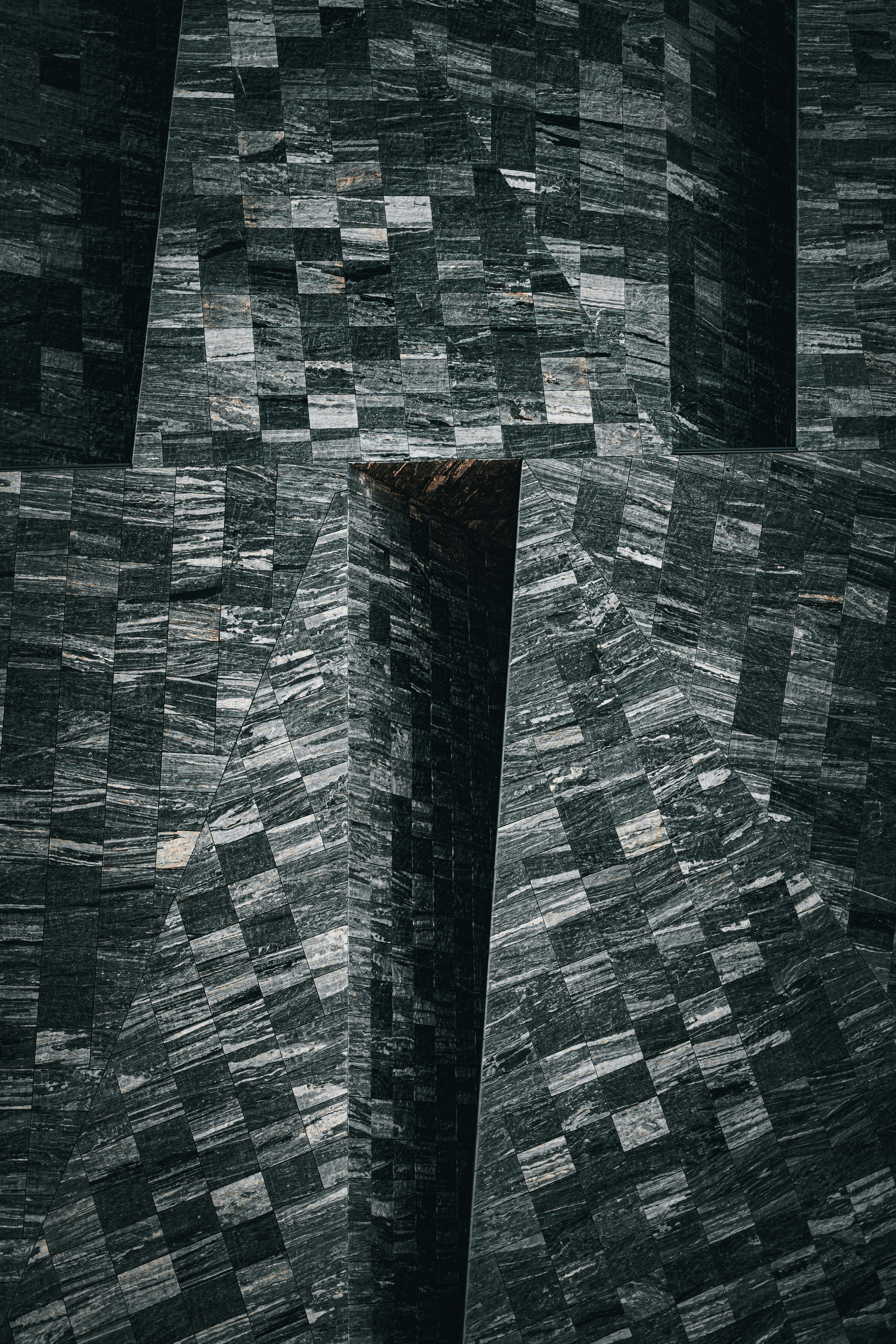 The Monolithic Vein: A Narrow Shadow in a Tessellated Facade